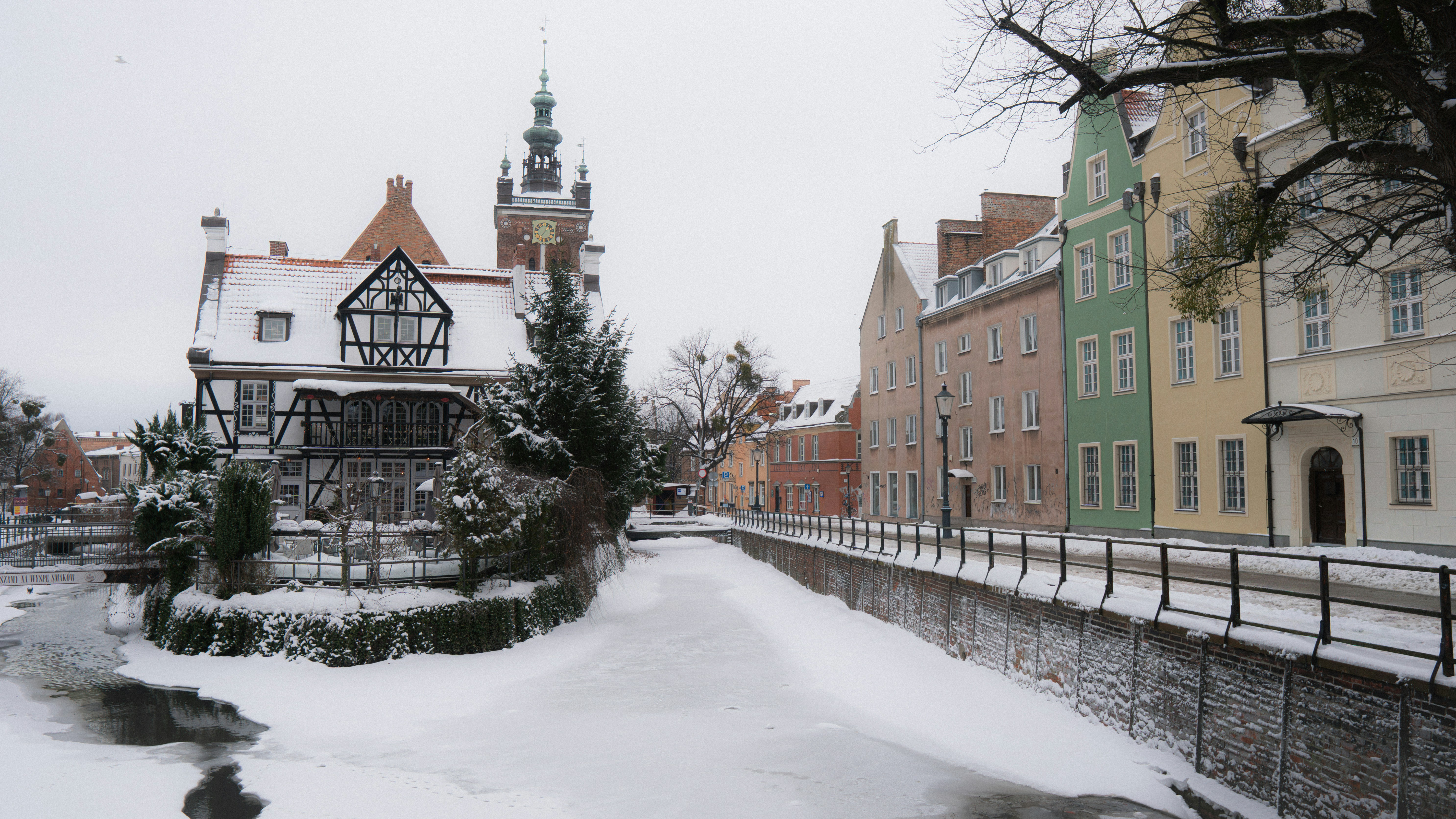 Snowbound Riverside Row: Historic Homes Dusting the Winter