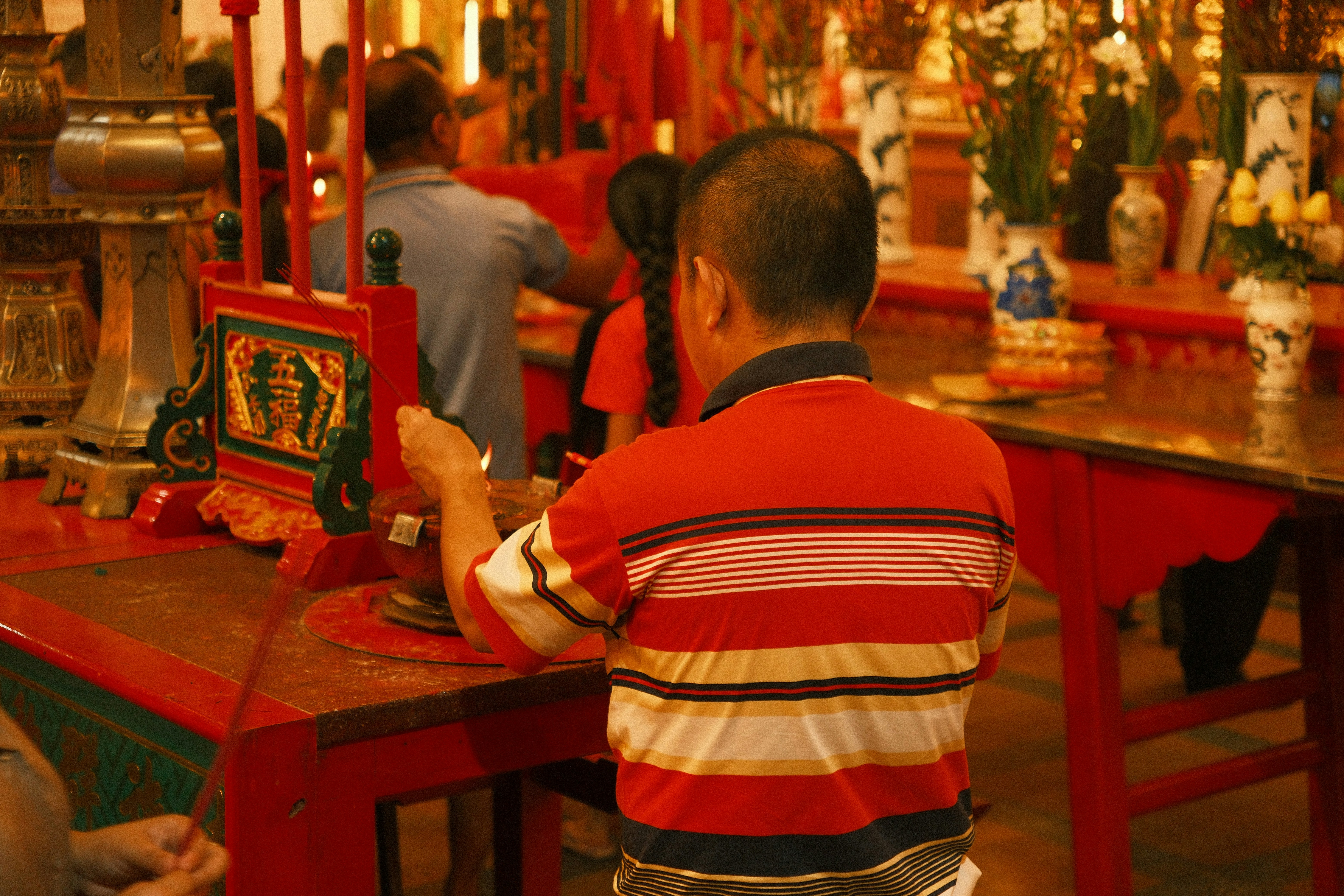 Red-Striped Attendant at a Shrine Table