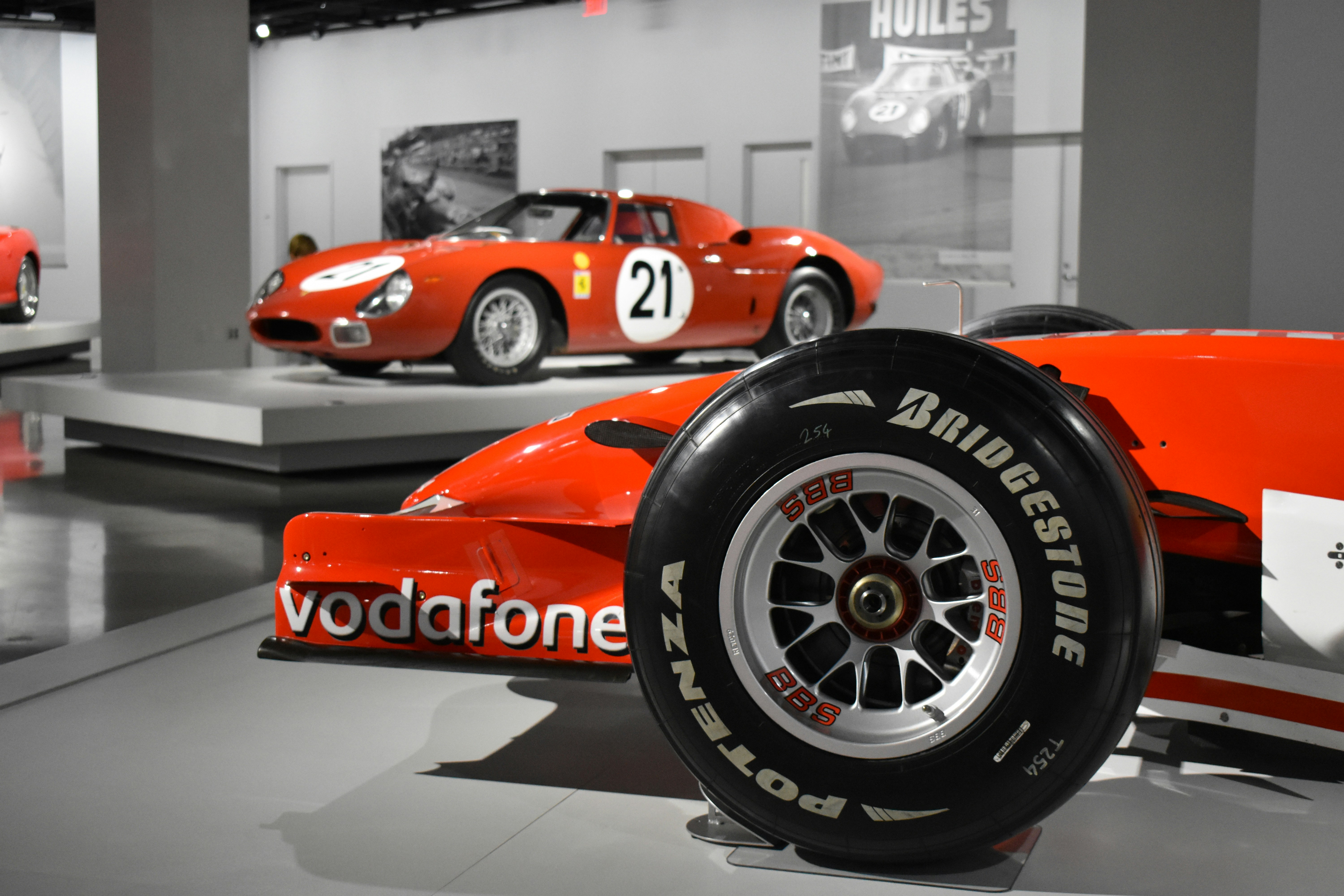 Race Museum Radiance: A Close-Up of a Branded Tire in a Vintage Car Display