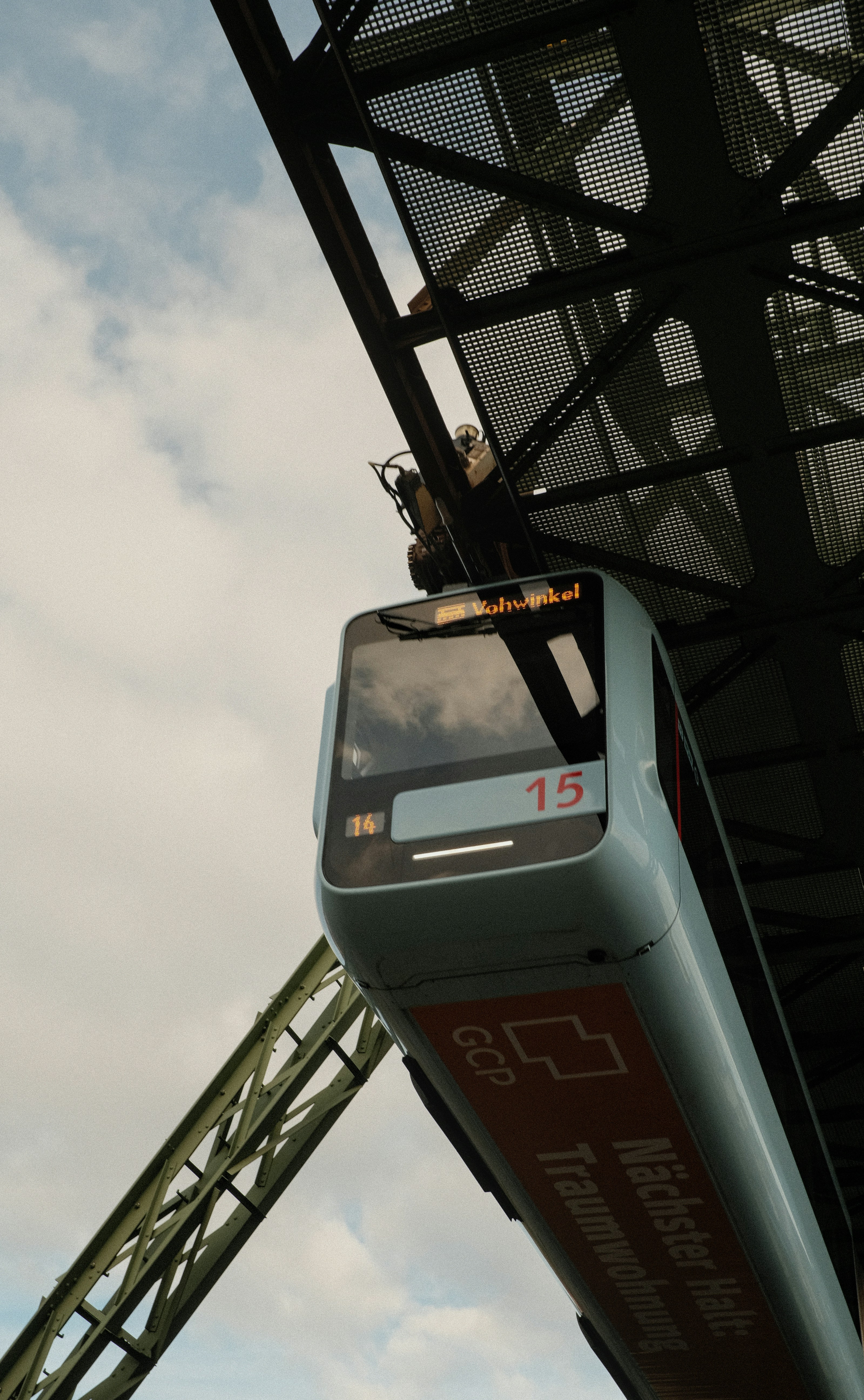 Elevated View: The Glass Cabin Clinging to Steel Arches