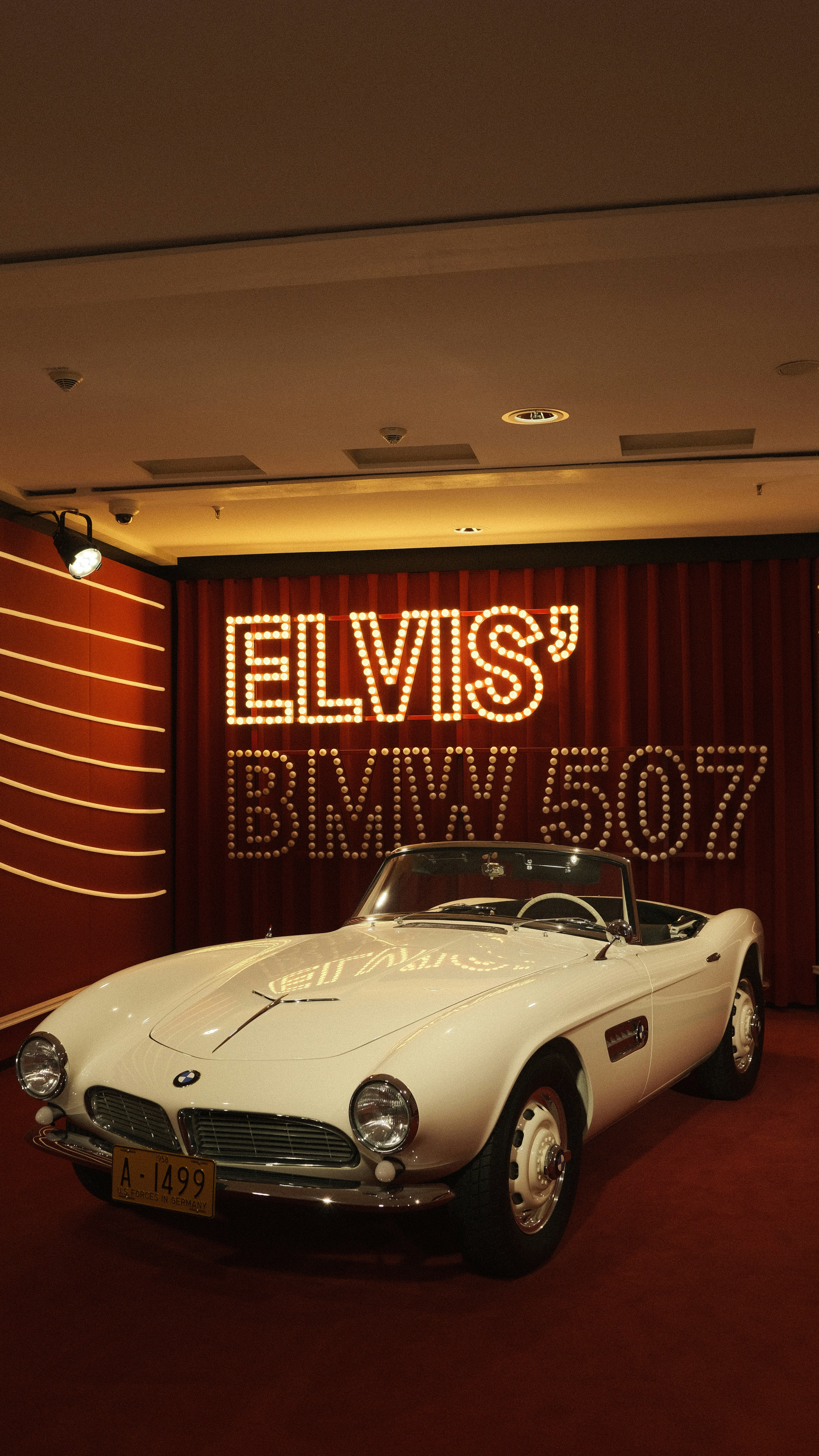 Elvis’s White Convertible Dream: A Vintage Showroom Moment