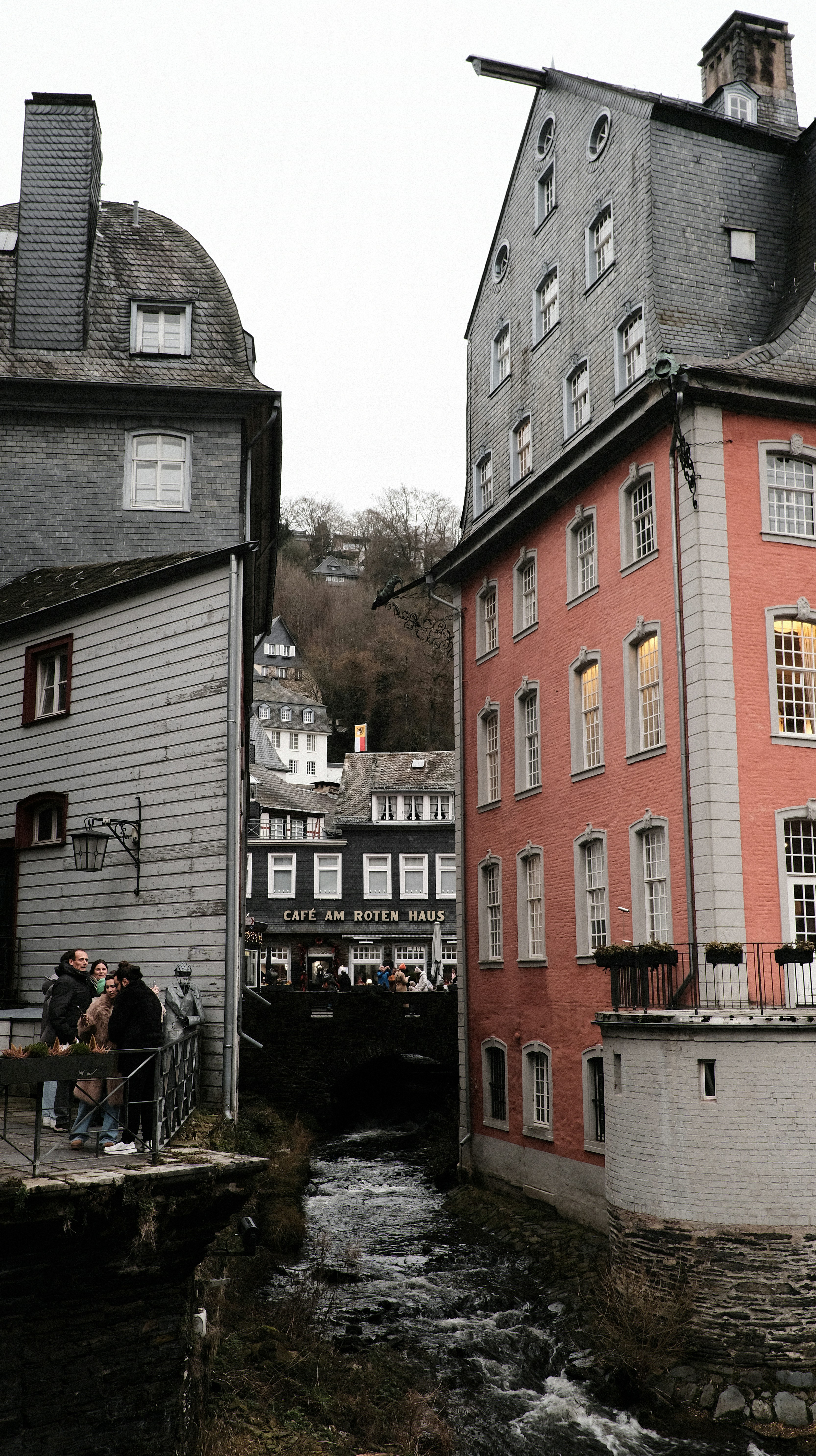 Pastel riverside passage: a medieval town tucked between canal and cliff