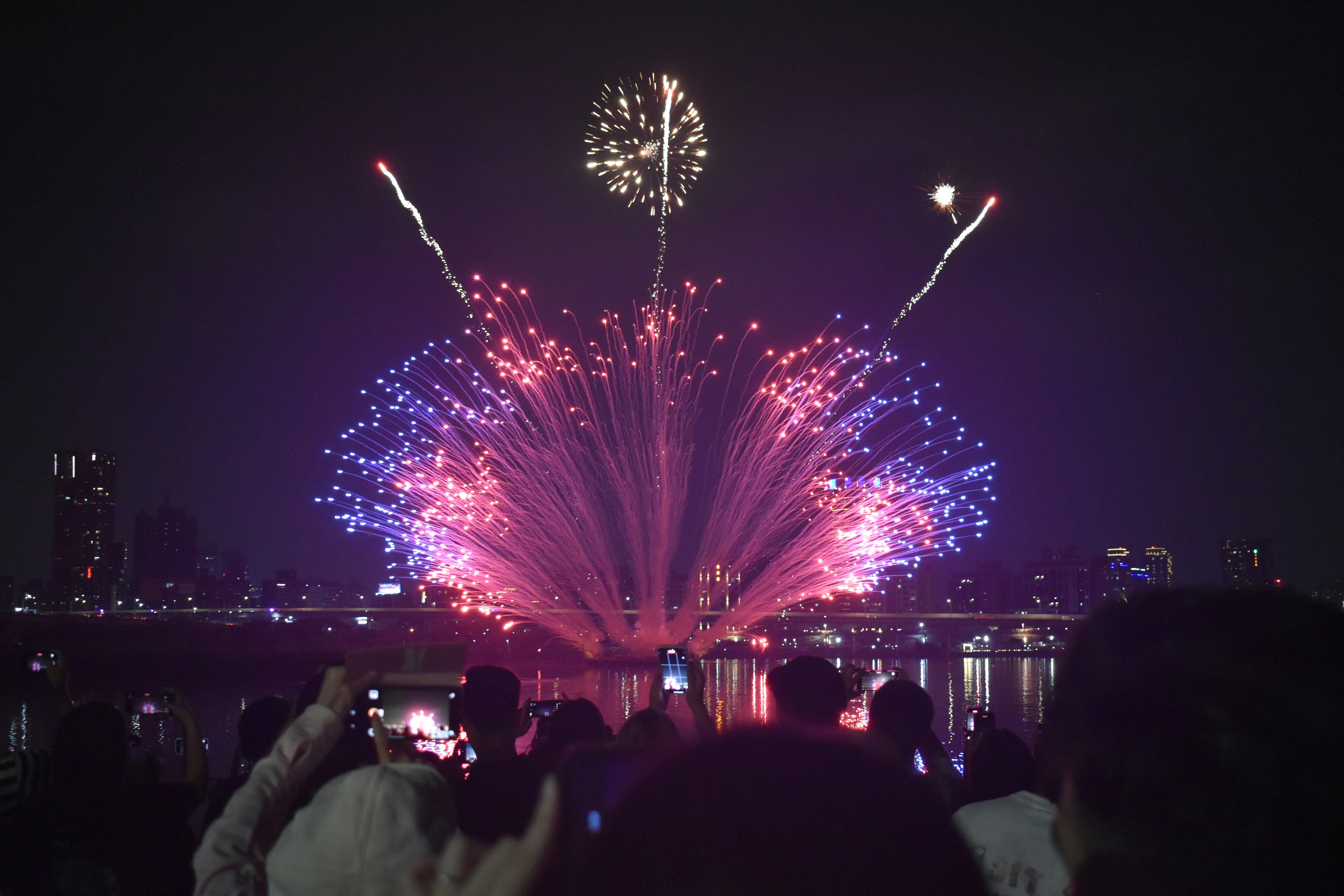 Night sky blooms over the crowd: a festival of fireworks
