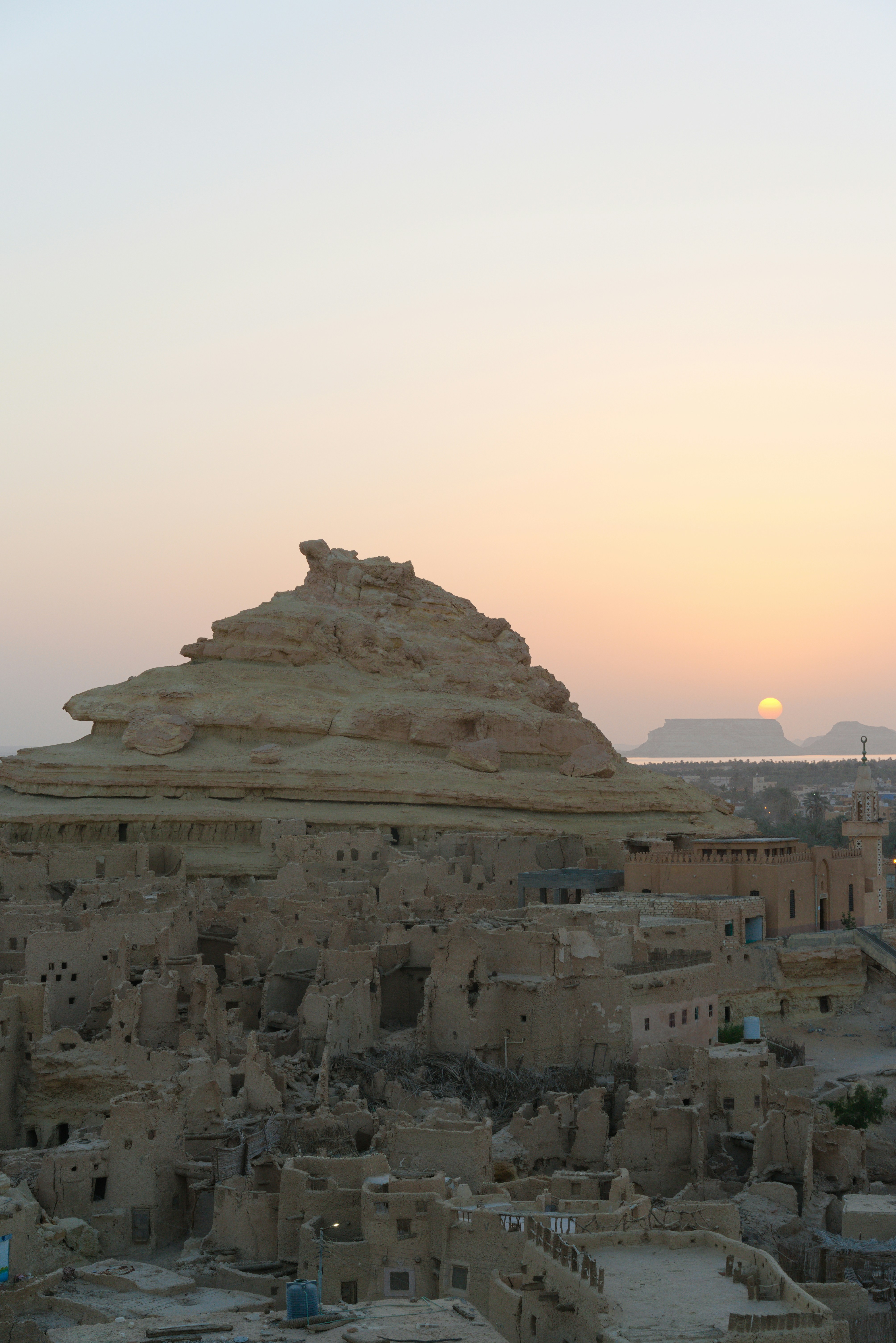 Sunset Over the Ancient City: A Pillar of Stone and Time