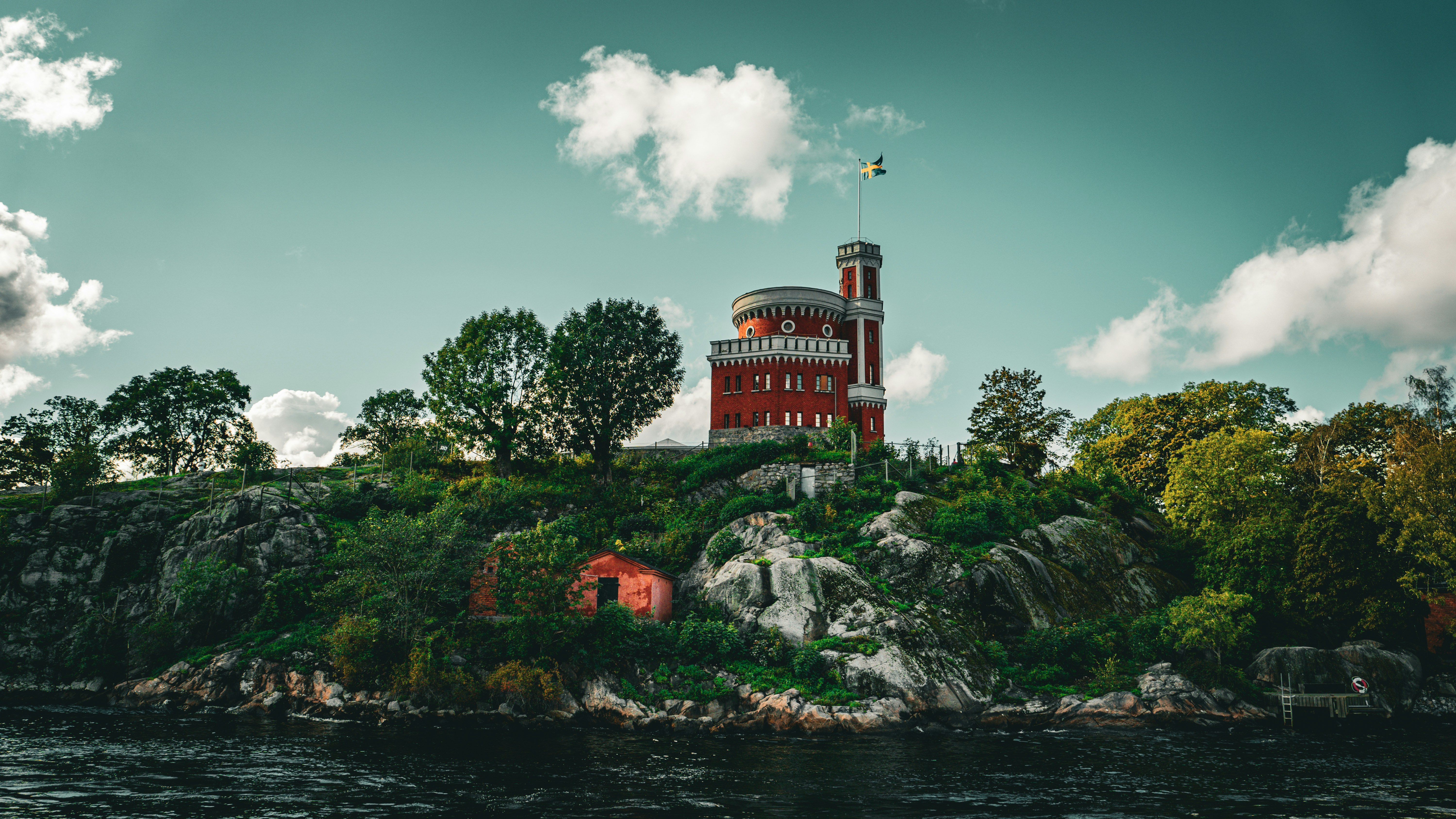 Harbor Keep: A Red Brick Turret Standing Guard Over Turbulent Waters