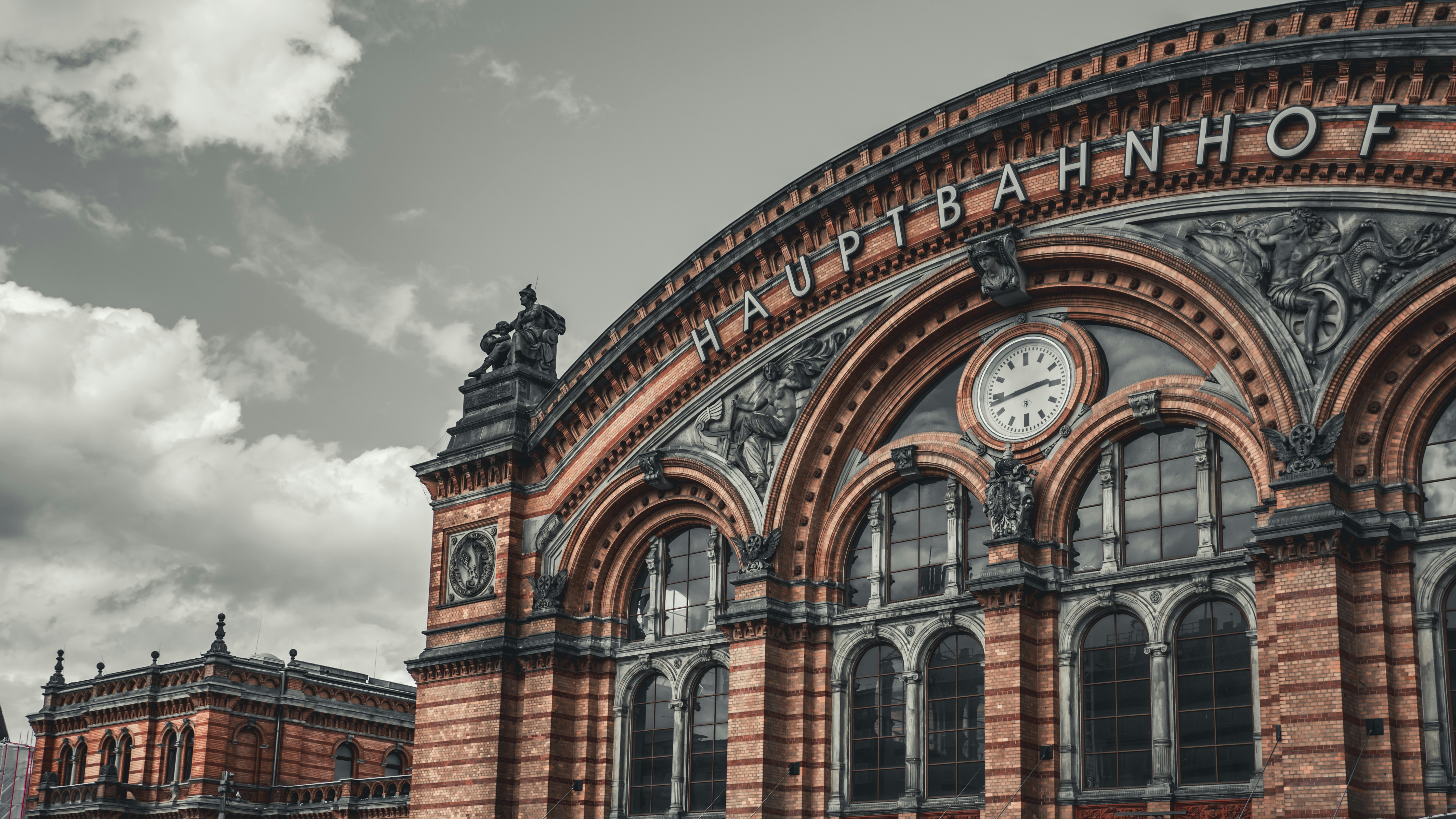 Brick Clocktower Facade: Historic Station Arches at Dusk