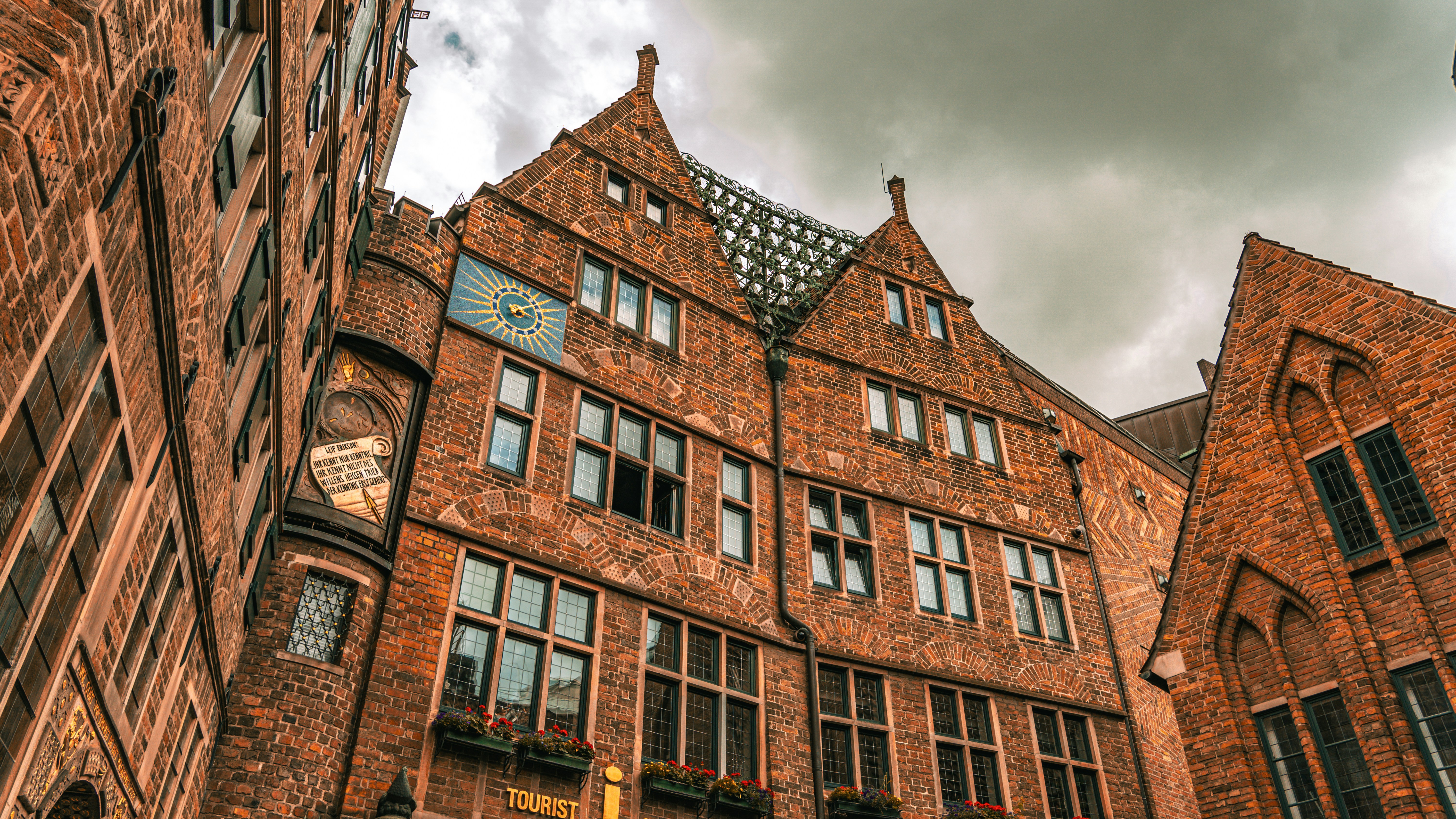 Brick Gothic Facades under a Stormy Sky
