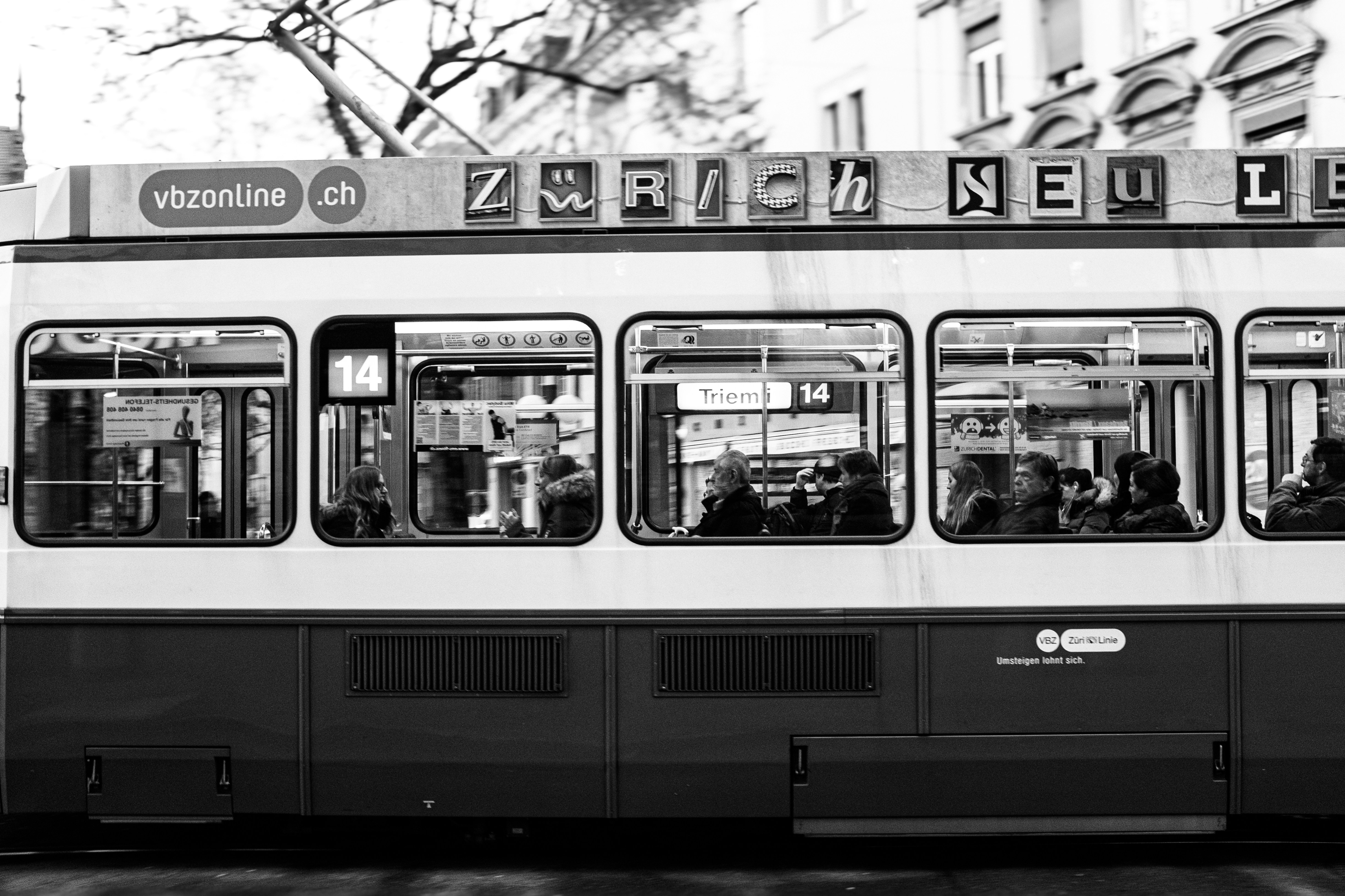 Silhouettes in Transit: A Black-and-White Slice of City Tram Life