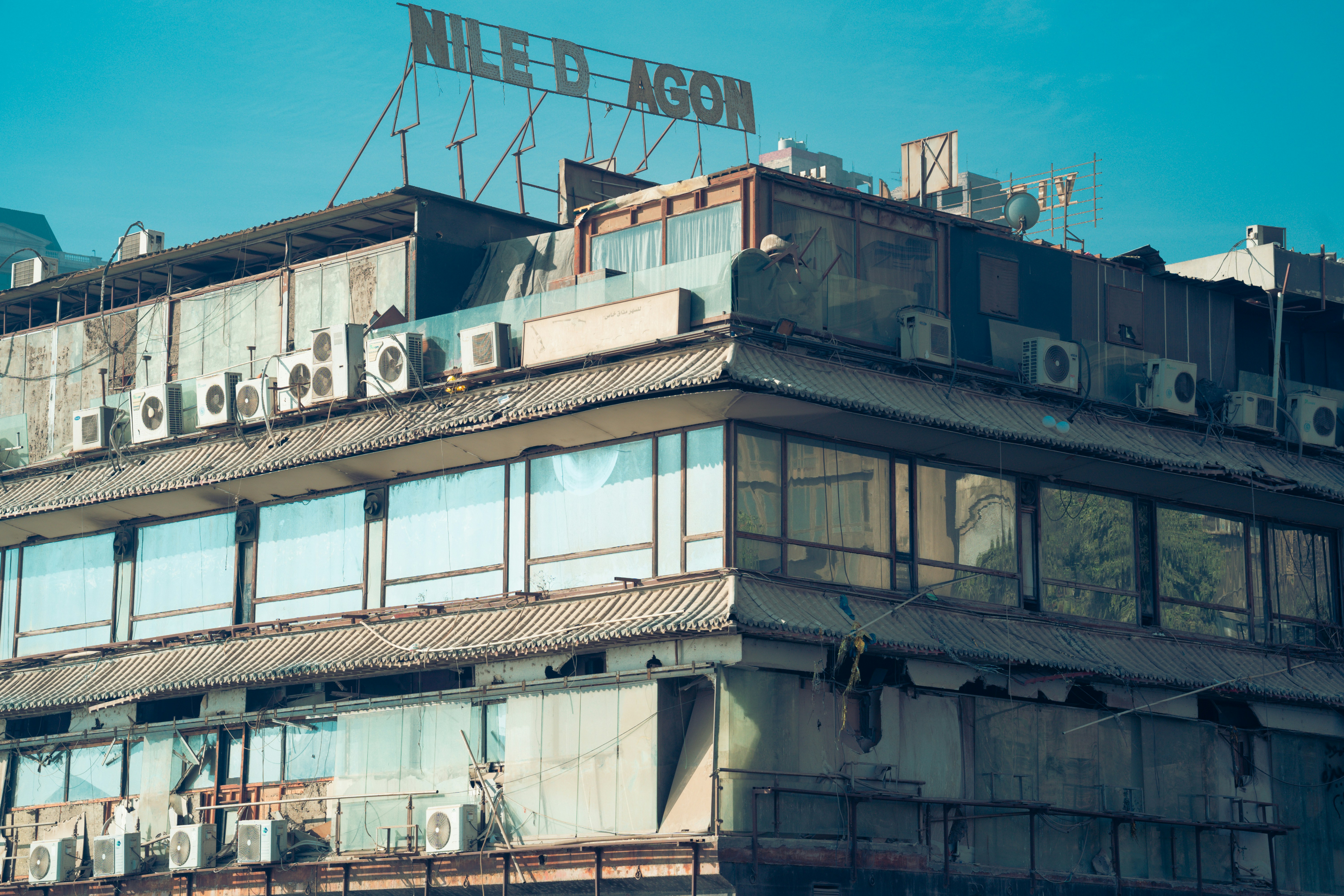 Urban Facade in Focus: Weathered Theater of Windows and HVAC