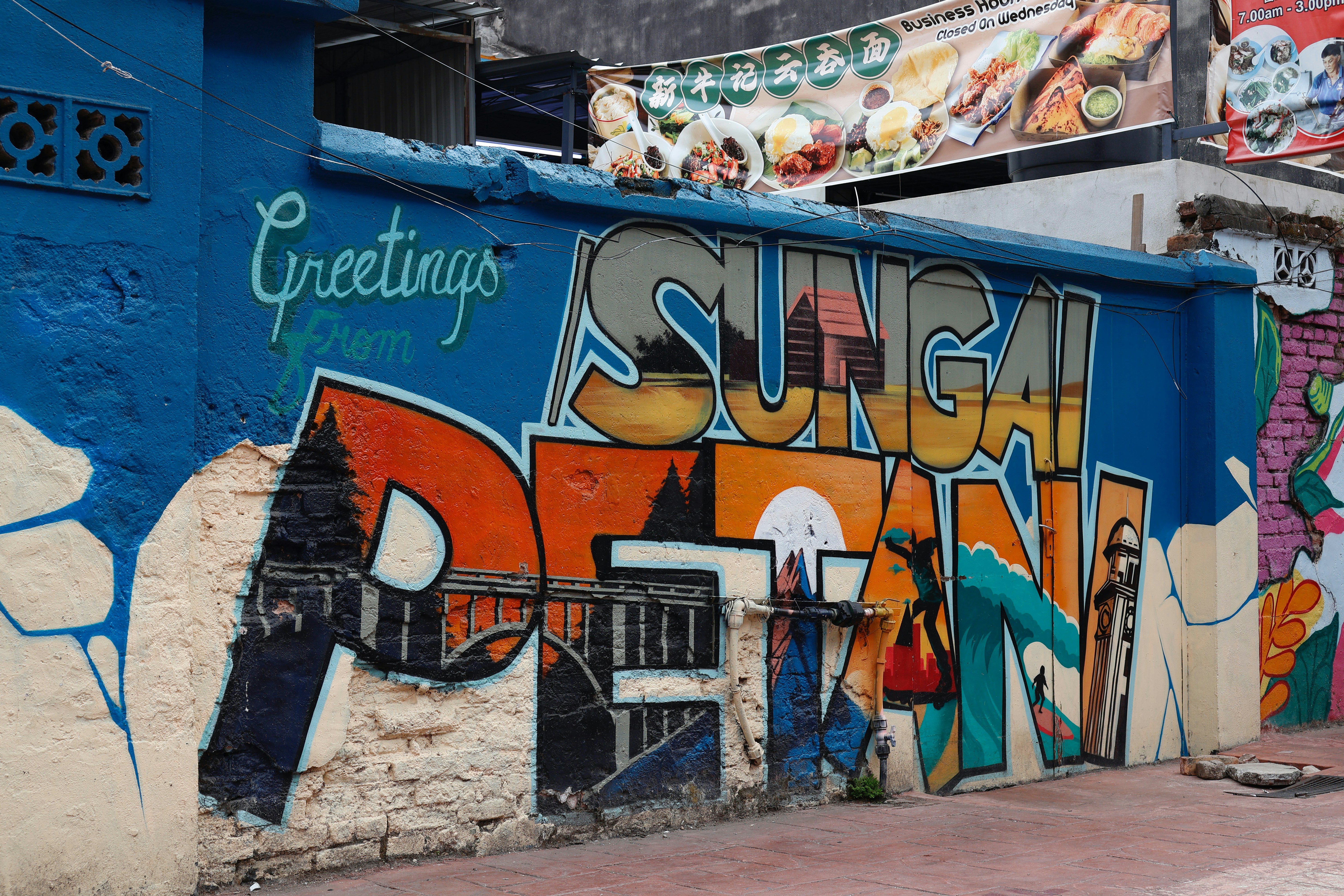 Graffiti Down a Colorful Alley: Sungai Deden Mural Scene