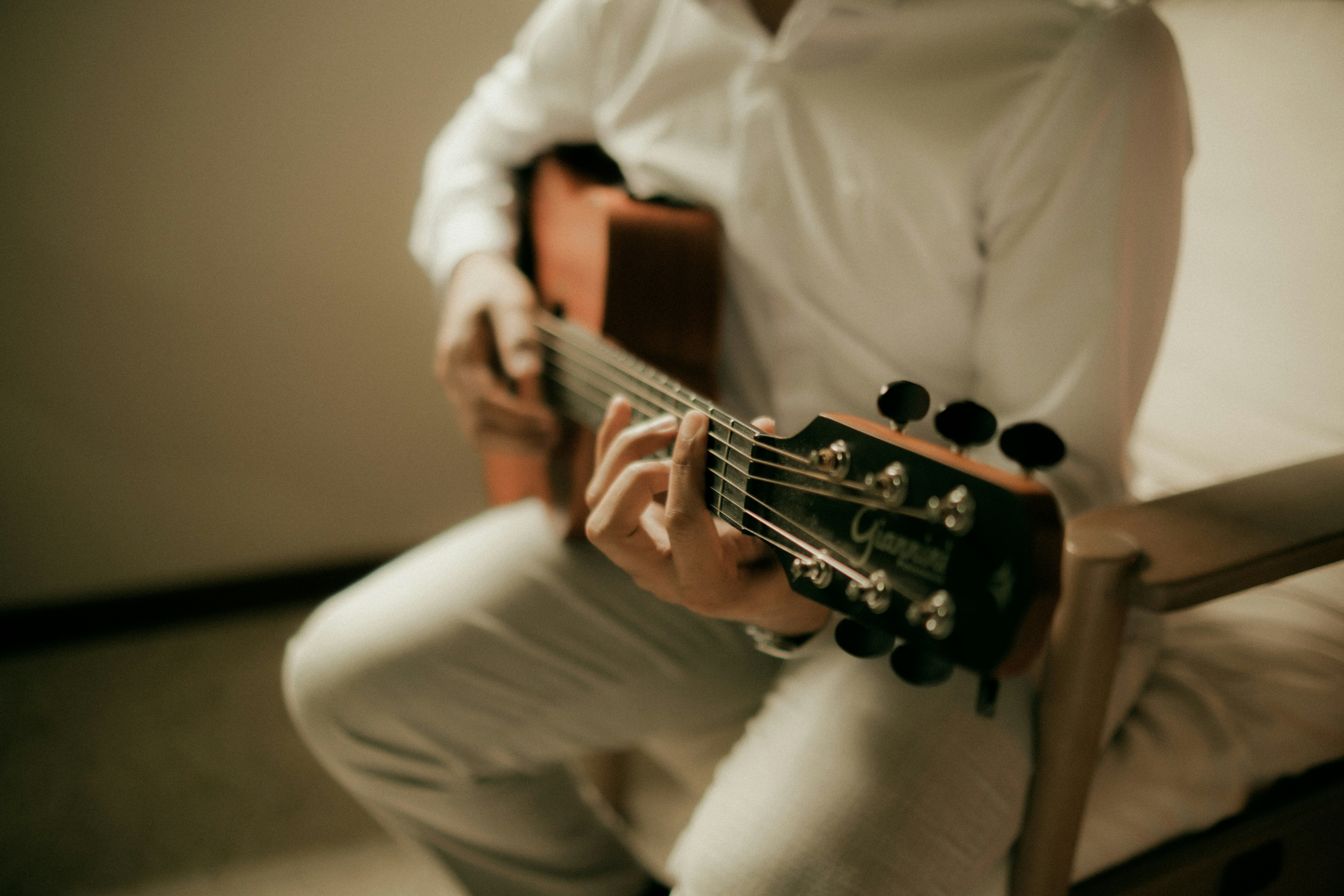 Gentle Strum: A Quiet Guitar Moment in Soft Focus
