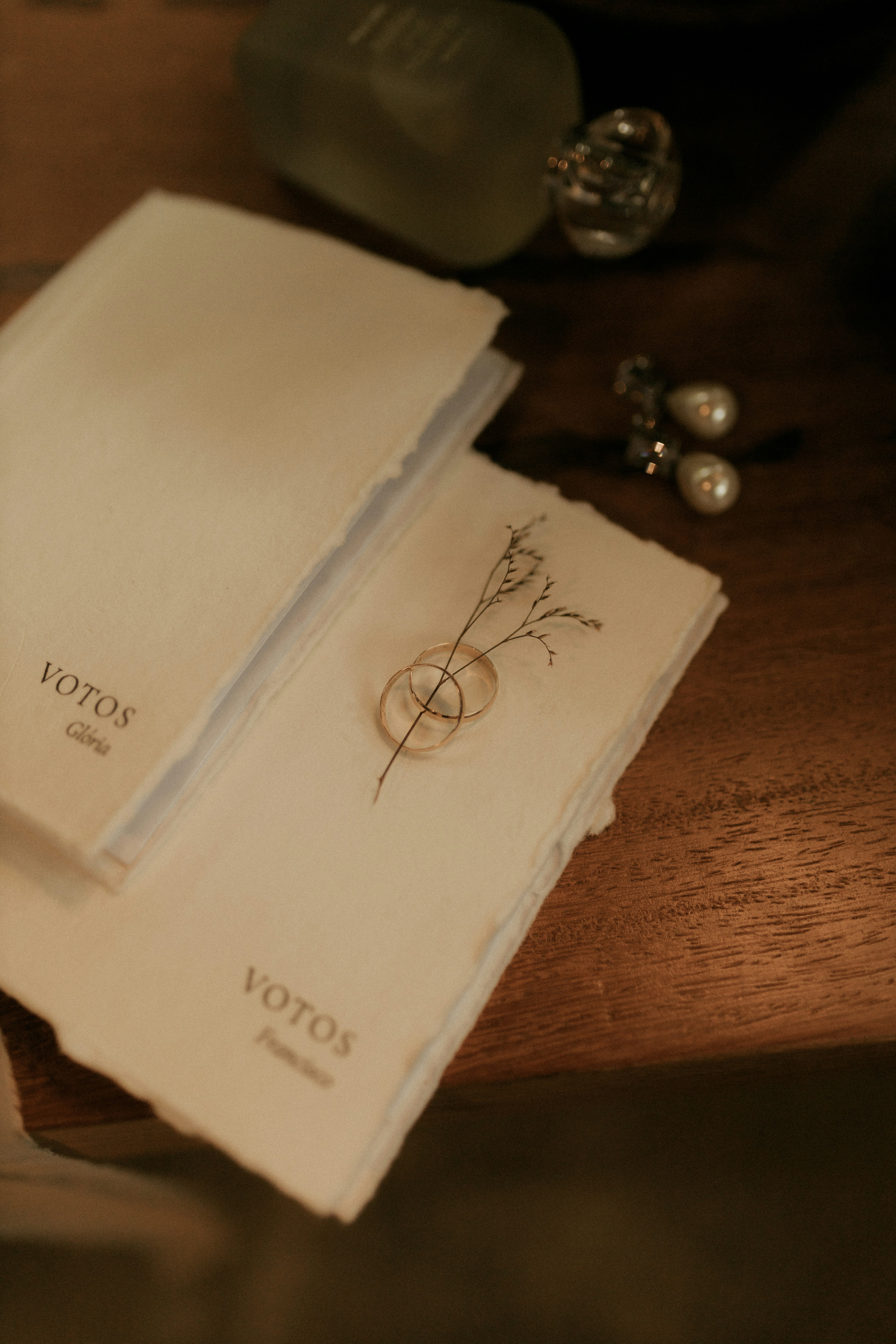 Wedding Rings and Votive Napkins: Quiet Still Life on a Wooden Table