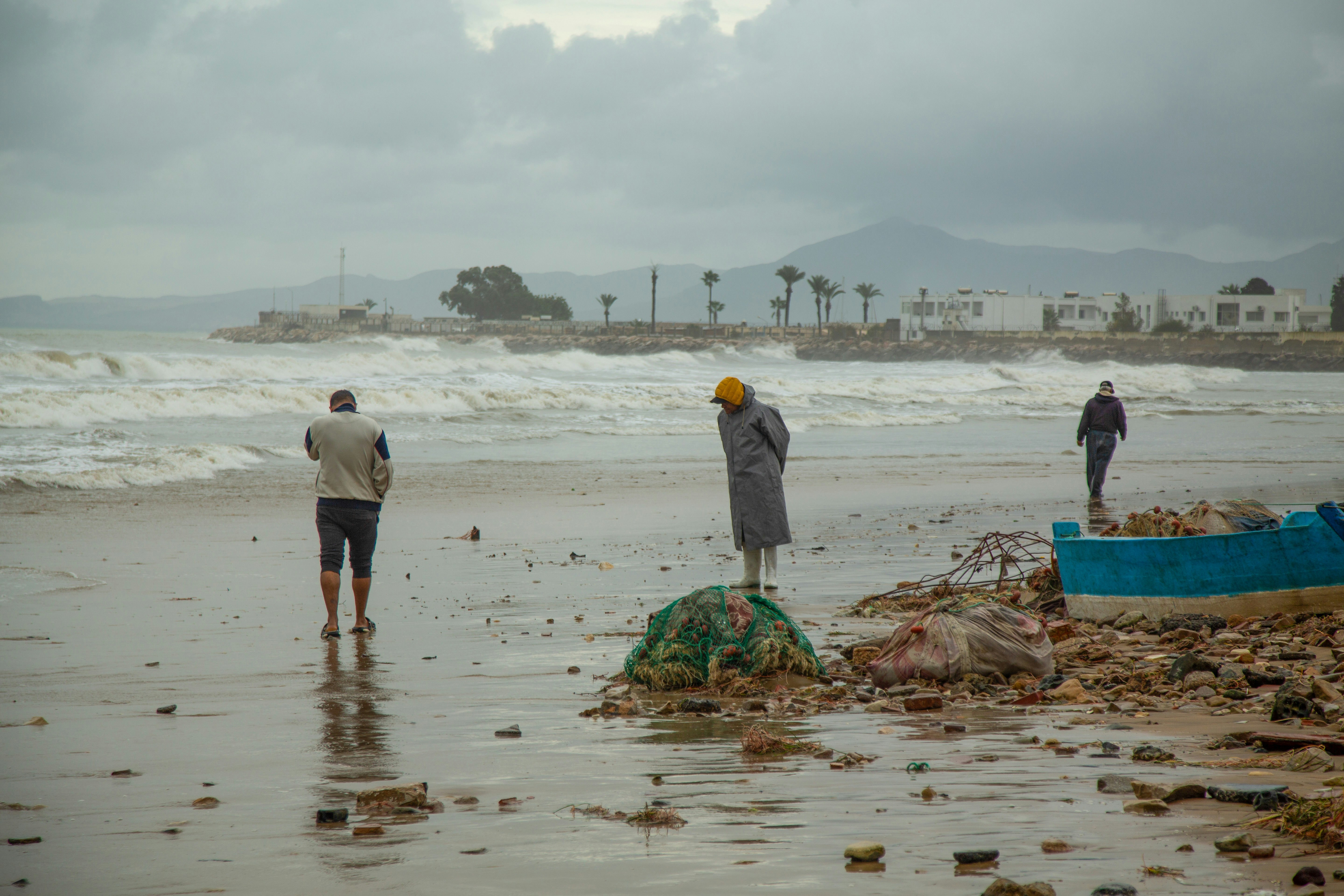 Stranded by the Tide: Figures on a Weathered Seashore
