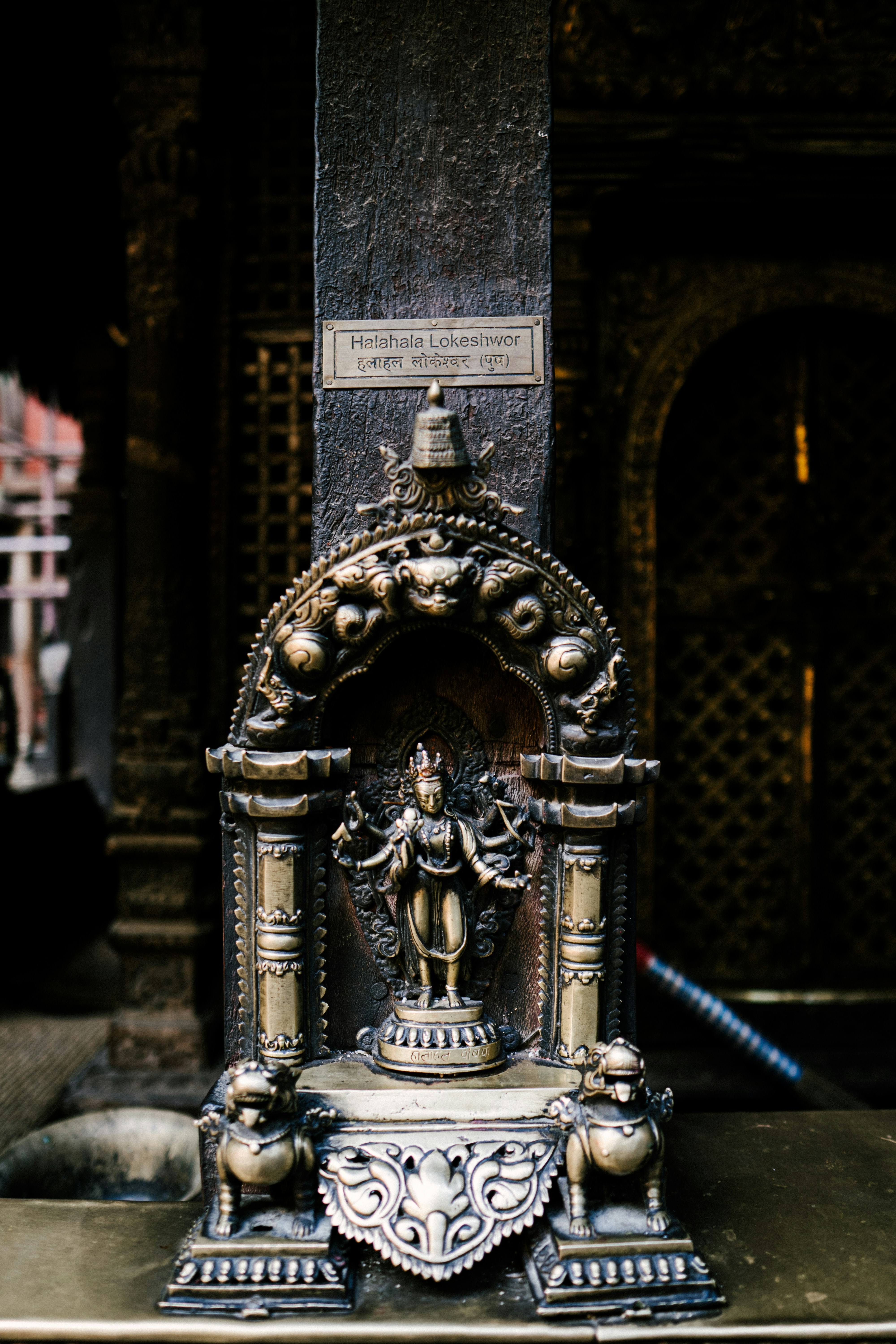 Ornate Shrine in a Dim Temple Corridor