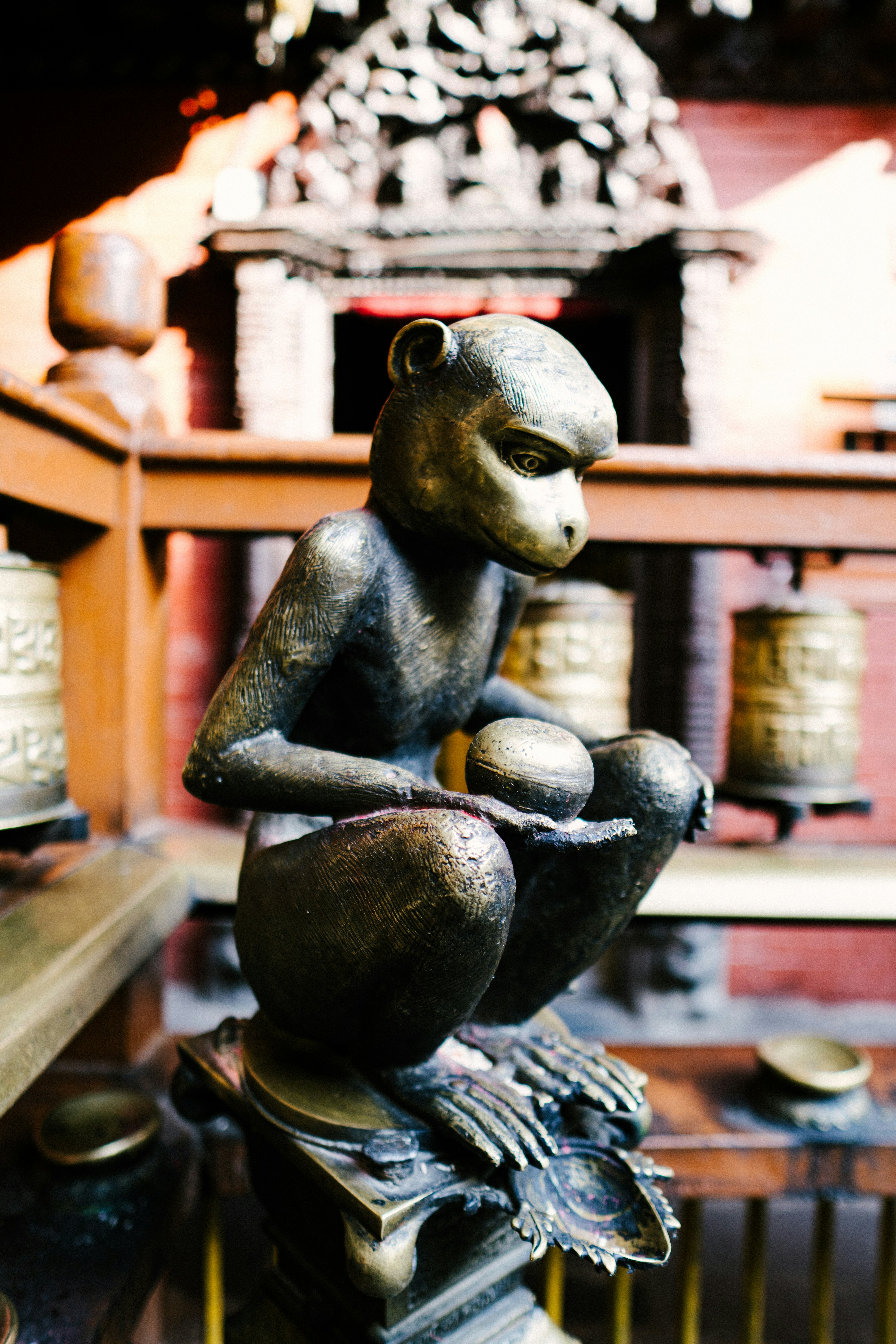 Bronze Monkey Cradle: A Quiet Moment in the Shrine