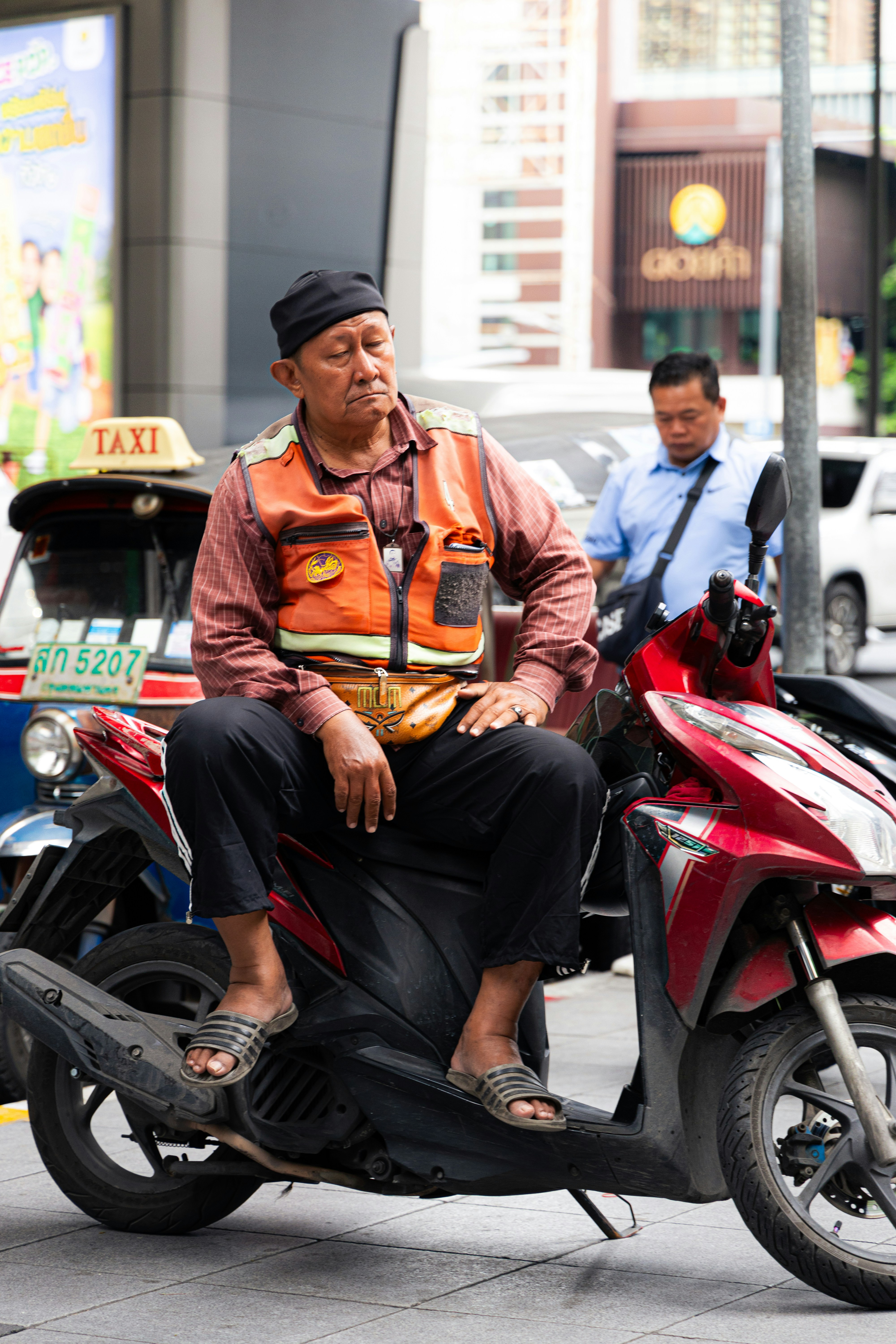 Sitting Taxi Dispatcher: Calm Focus on the Street Front
