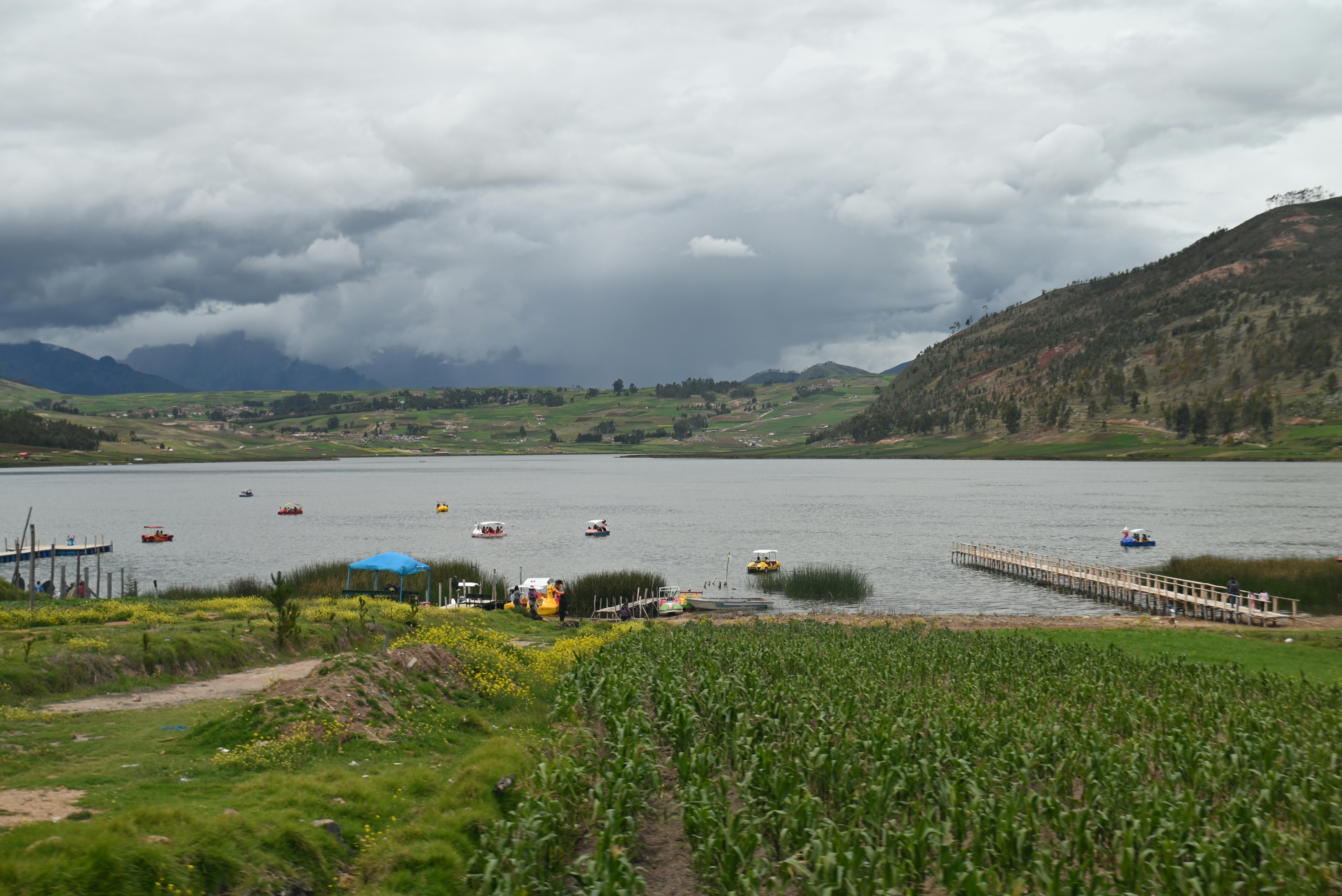 Boats at the Shore Under A Stormy Horizon