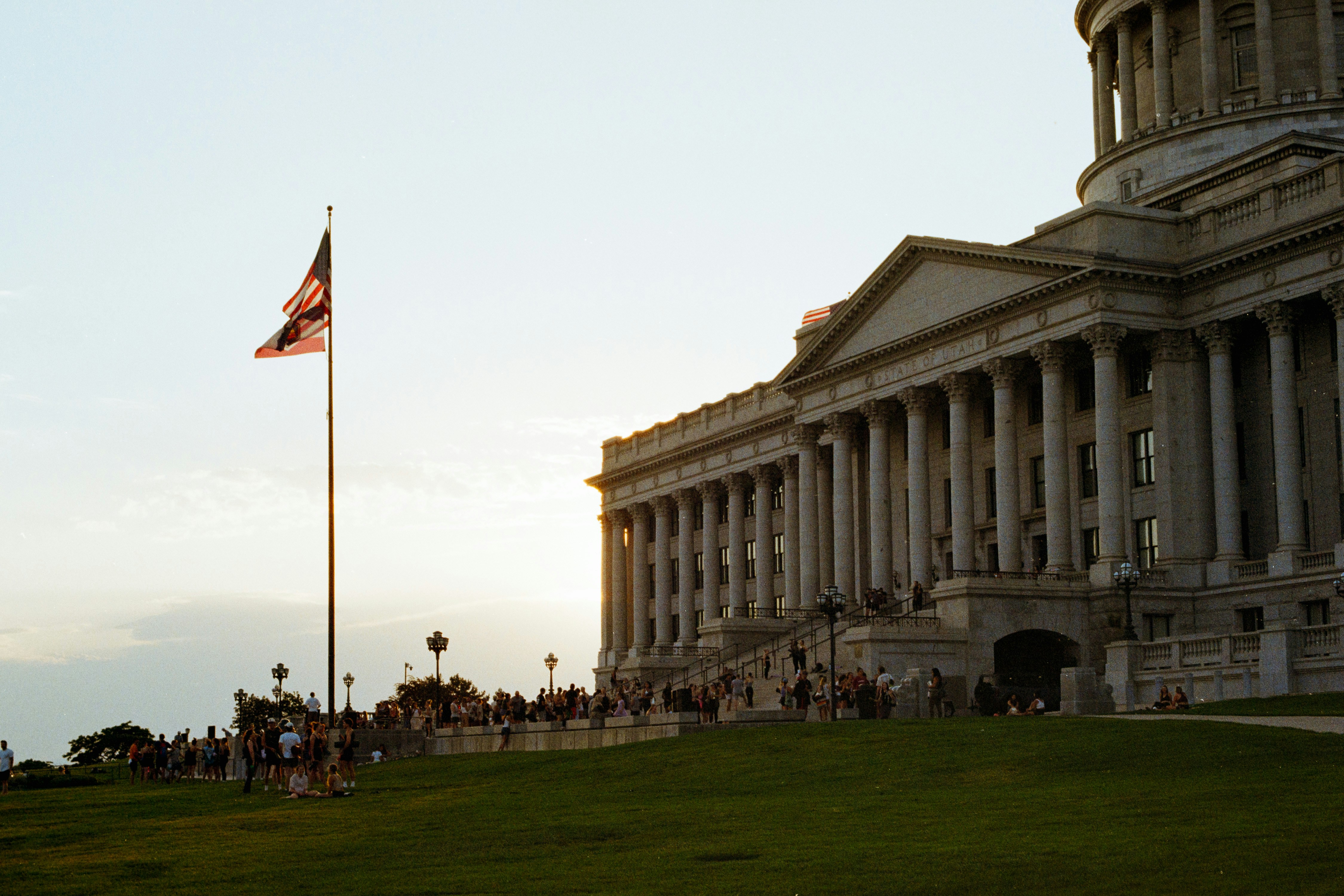 Sunlit Steps to the Capitol: A Quiet Crowd at Dusk
