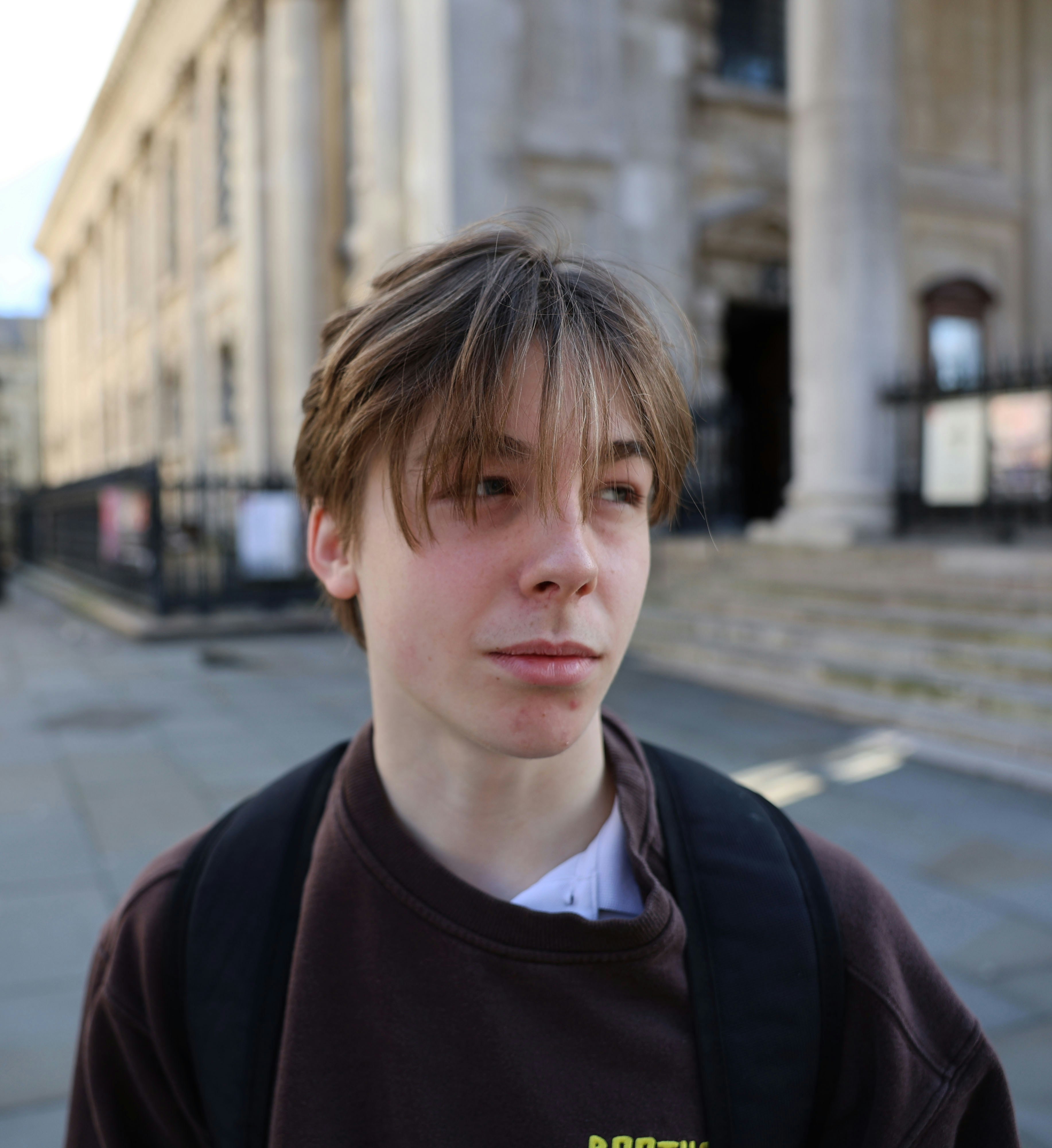 Youth in Focus: Portrait Before the Classical Facade
