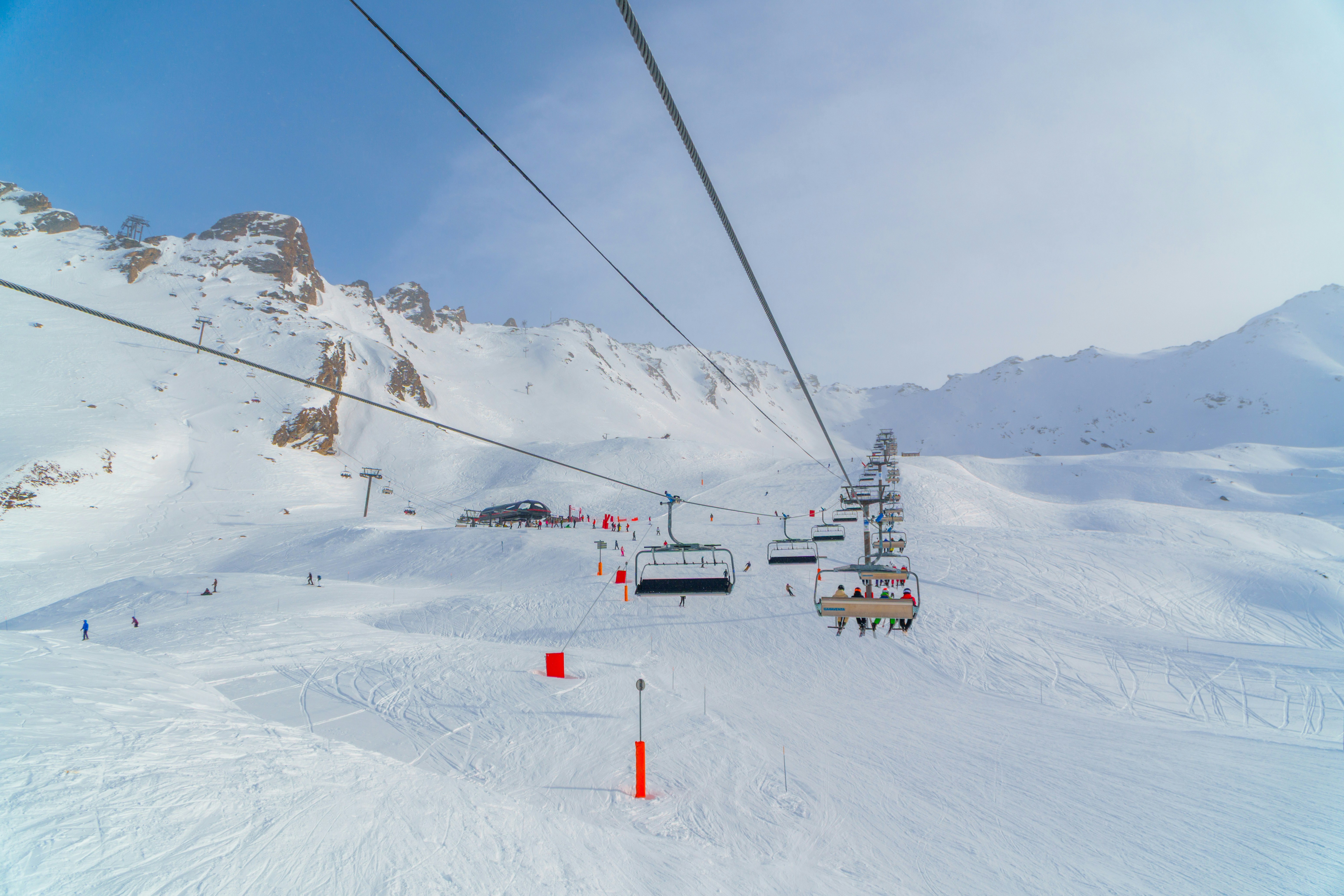 Ski Lift Silhouette Against Alpine Snowfield