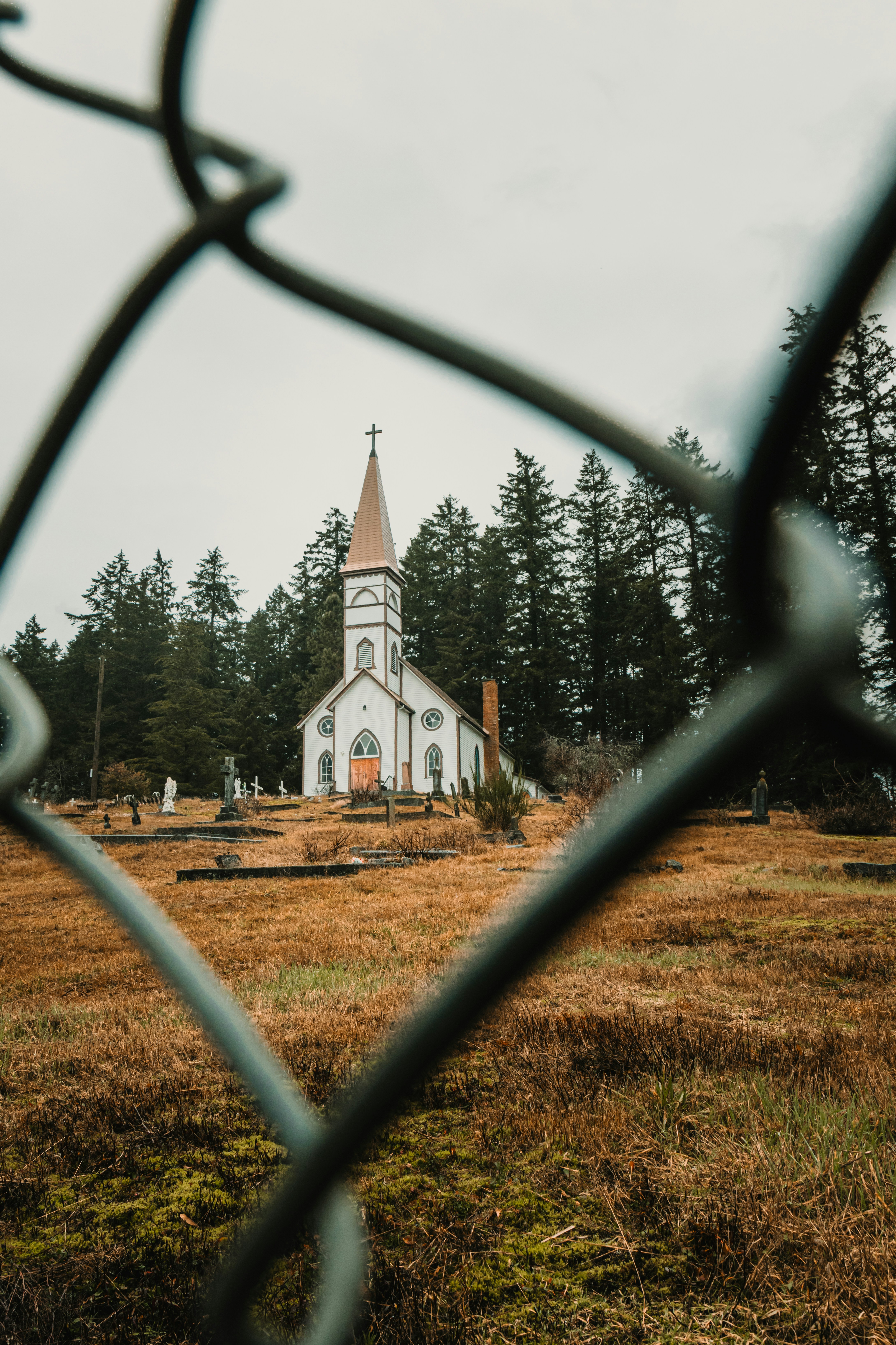 Chapel in the Park Behind a Rustic Chain-link Frame