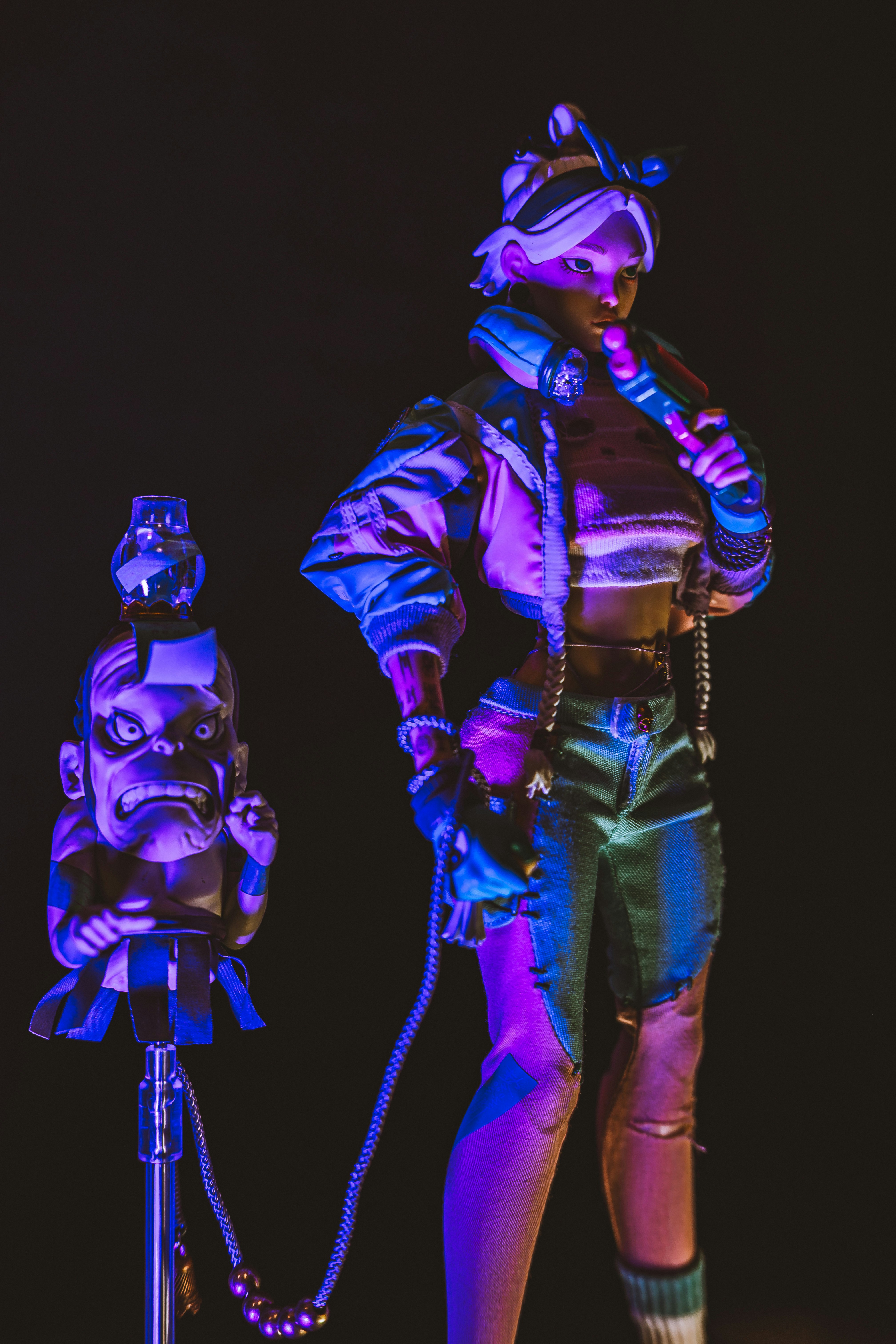Neon Diva and Mono Fable: A Nighttime Puppet Showdown
