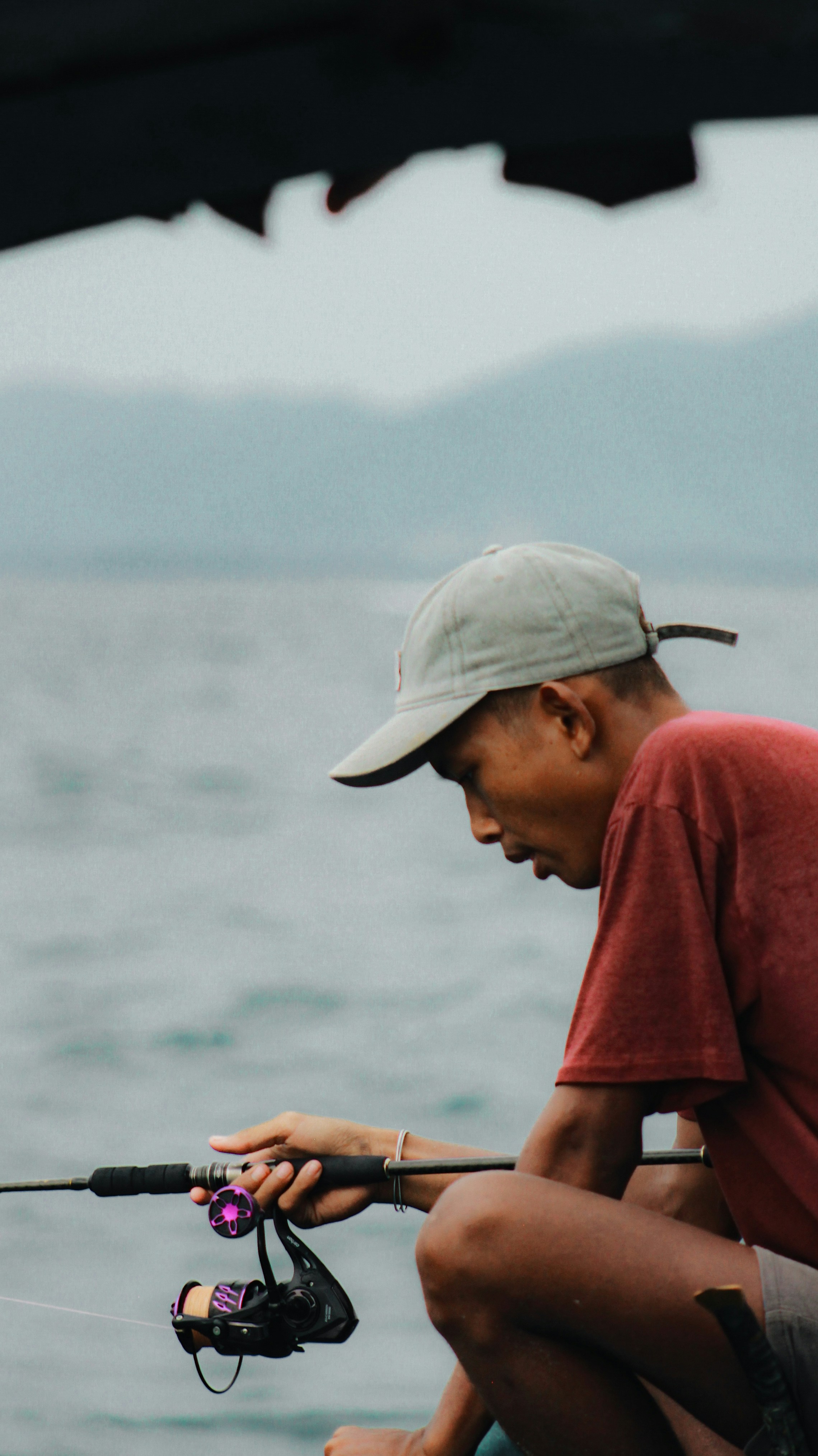 Angled Line: A Fisherman's Focus by the Sea
