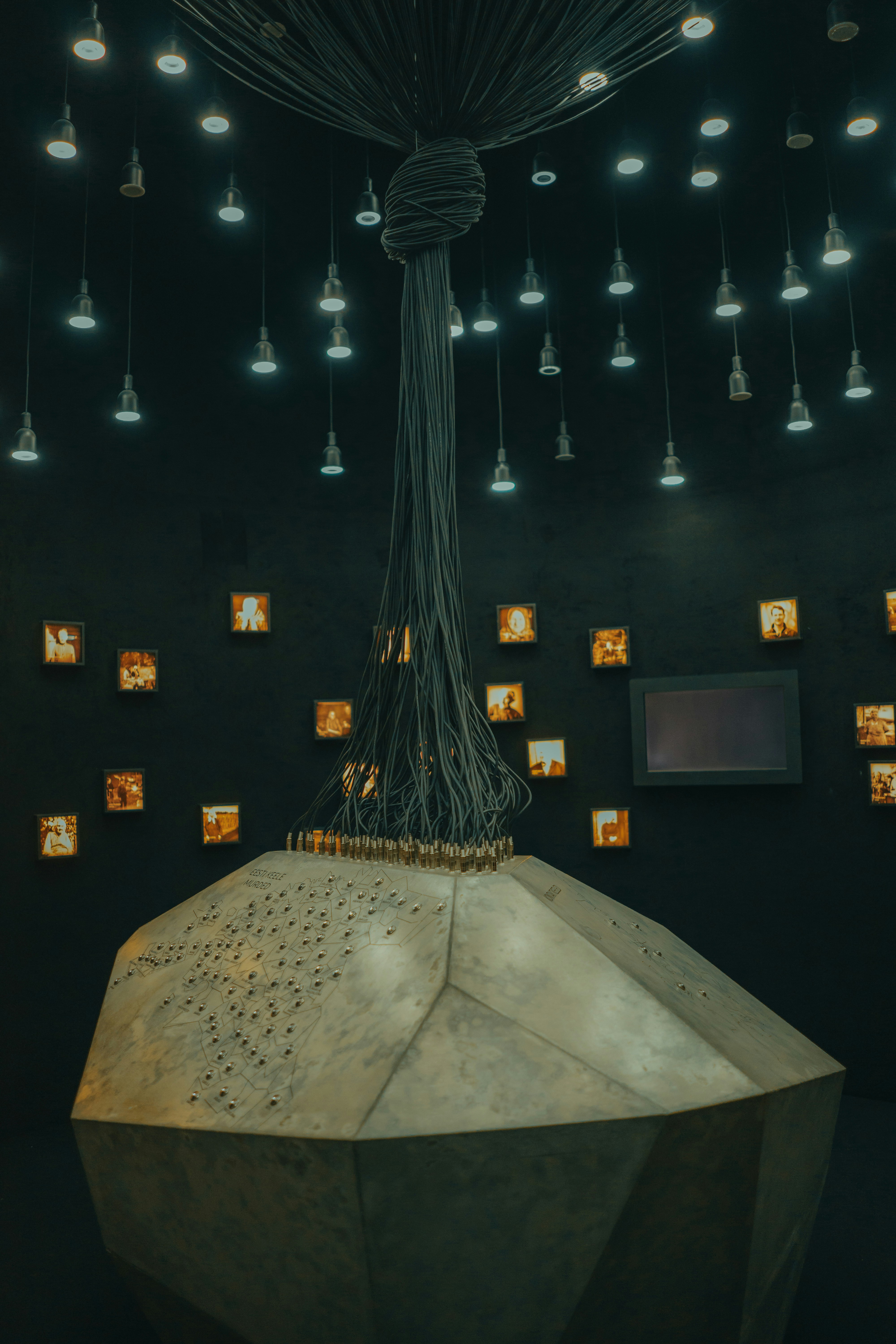 Tethered Light Orbs: A Centerpiece in a Dark Gallery