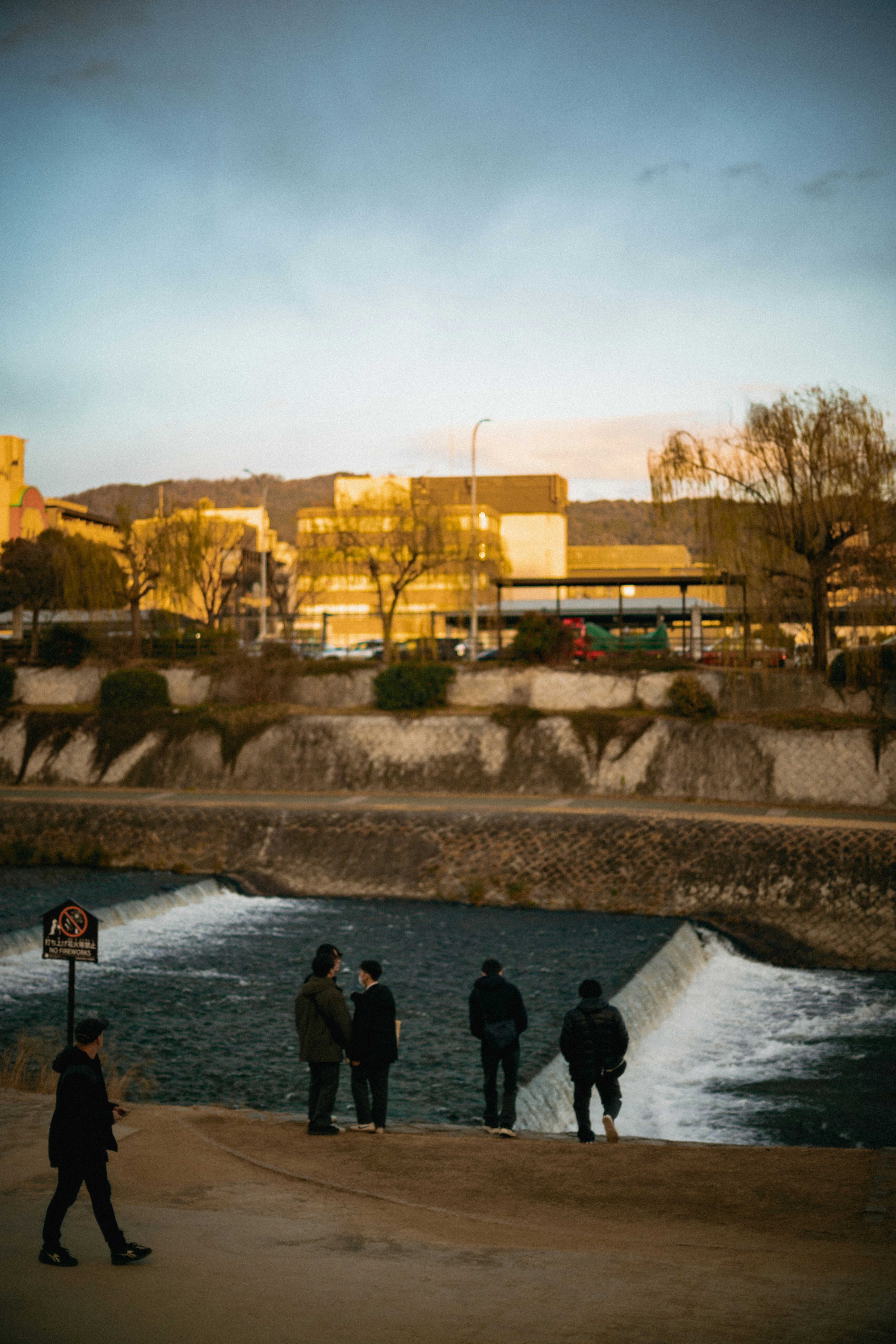 Riverbank Assembly at Dusk