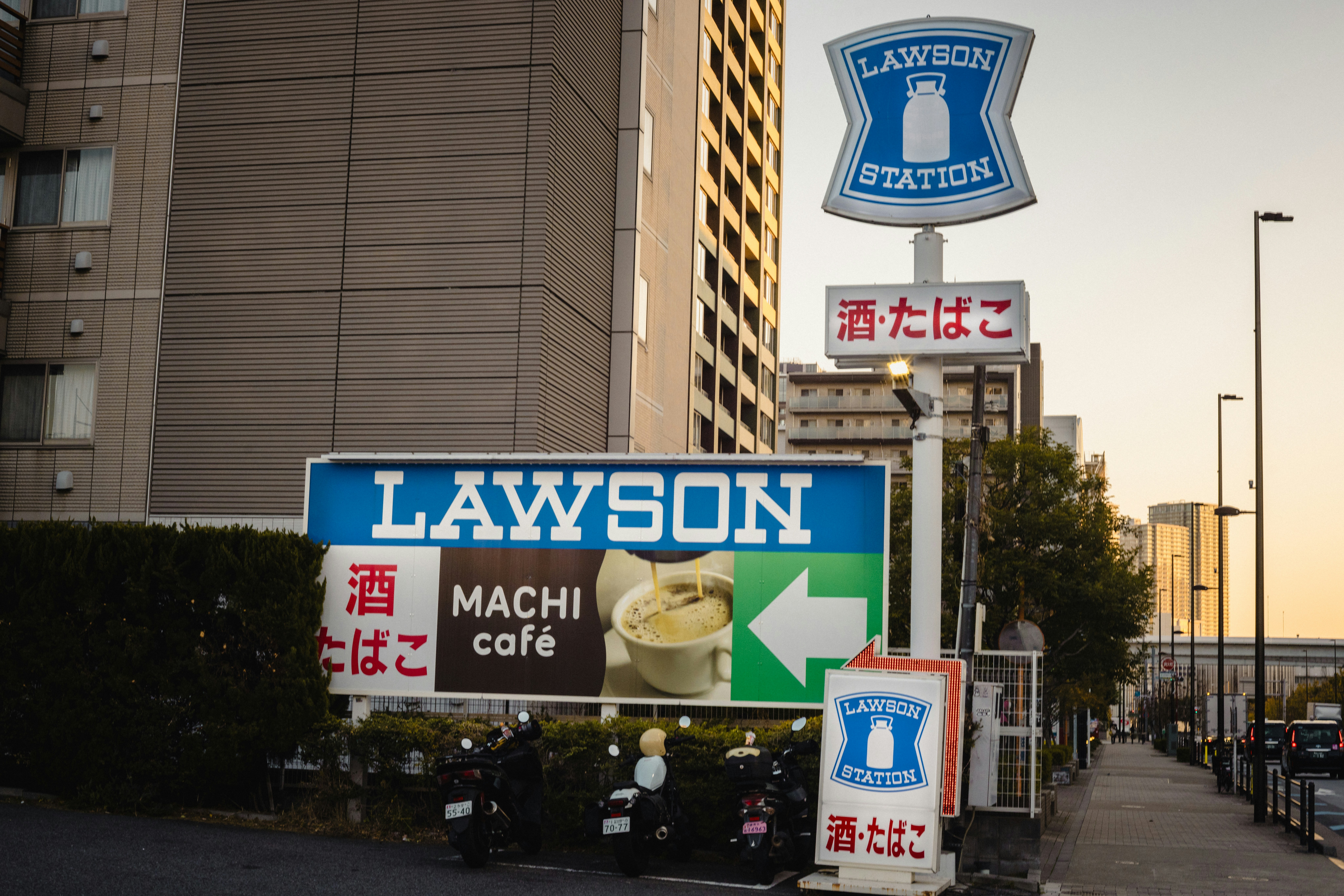 Neon Blue Signpost: A Lawson Convenience Hub in Soft Evening Light