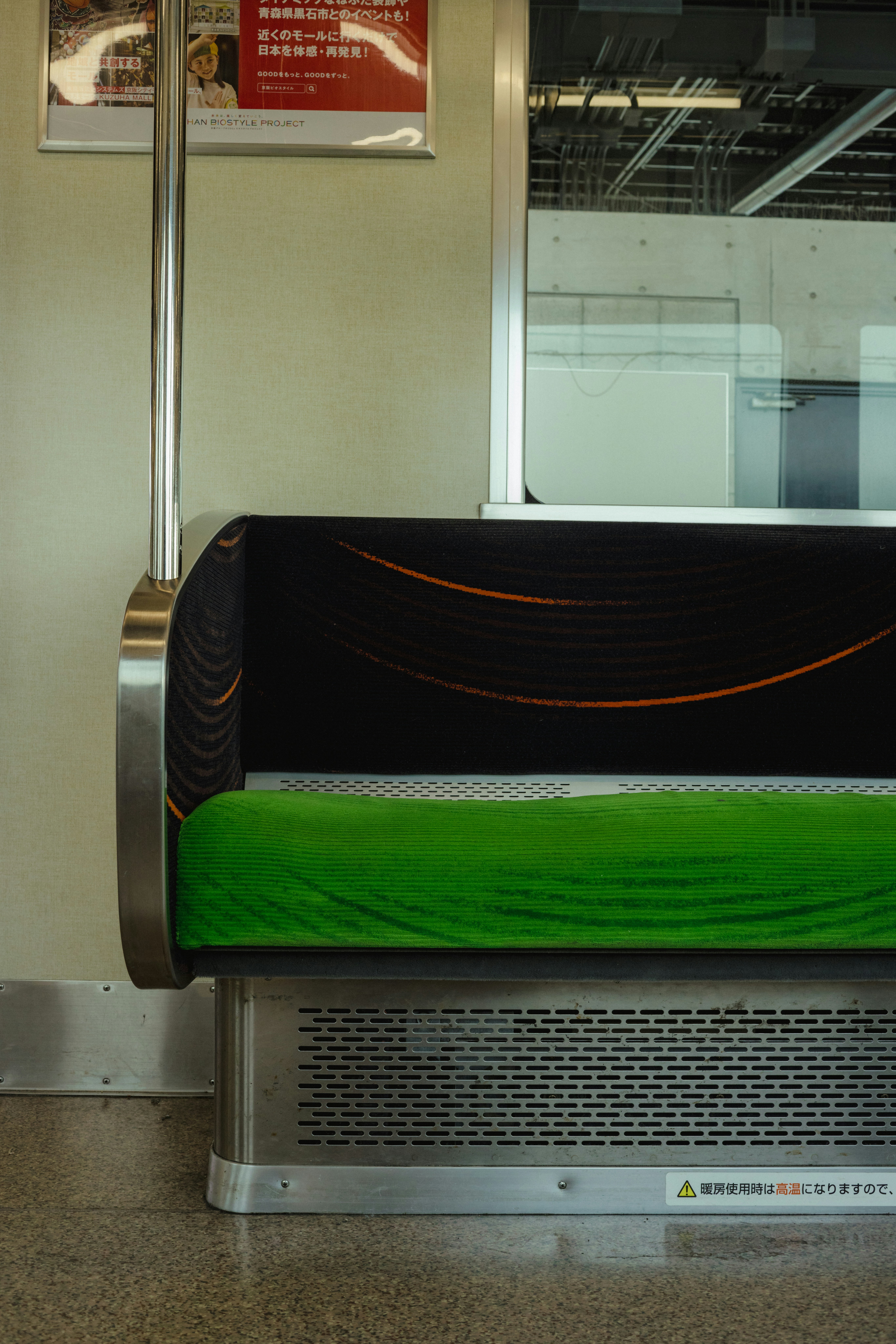 Green and Black Transit Seat: A Quiet Moment in a Modern Station