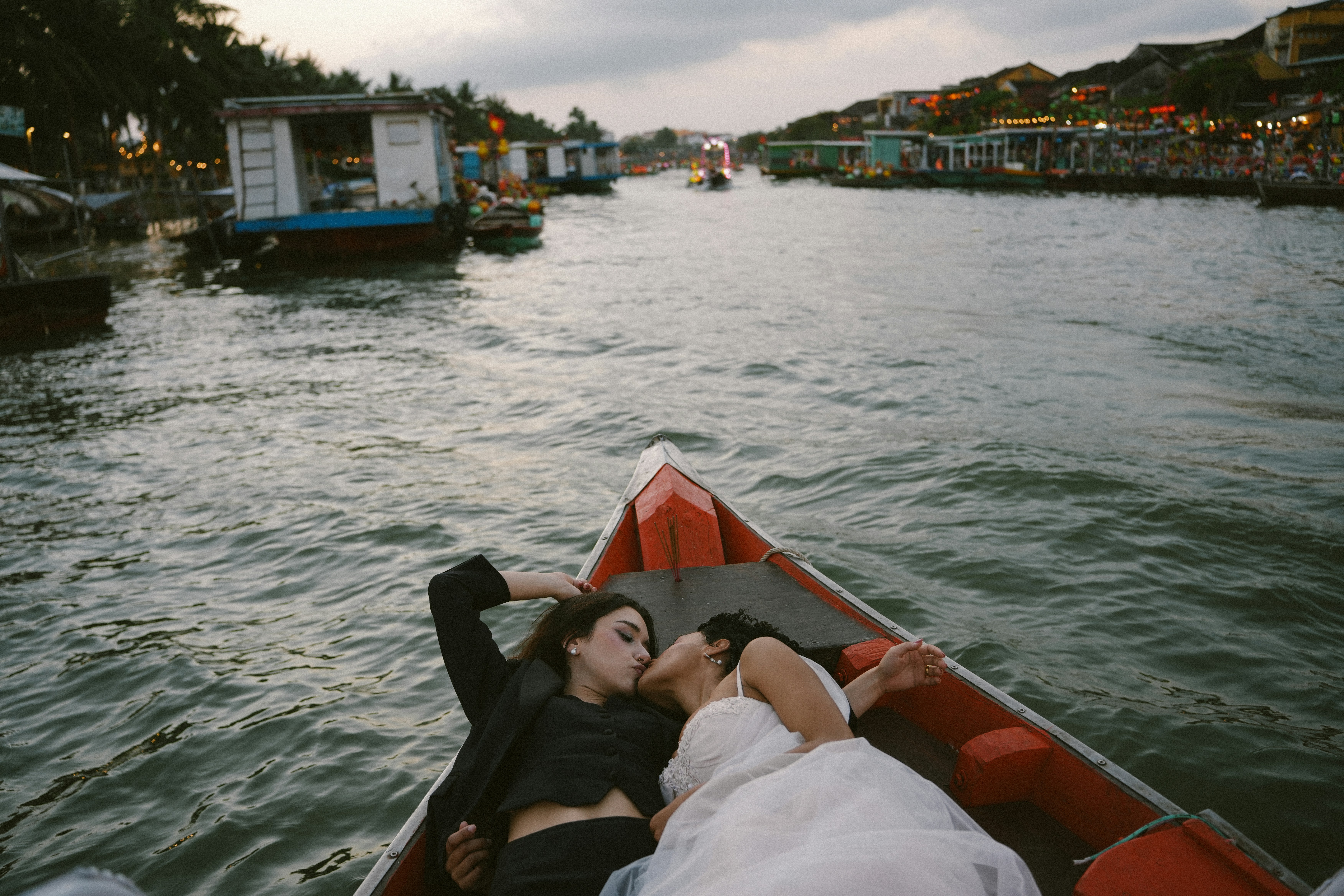 A Quiet Confession Afloat: Lovers Rest on a Canal Bend