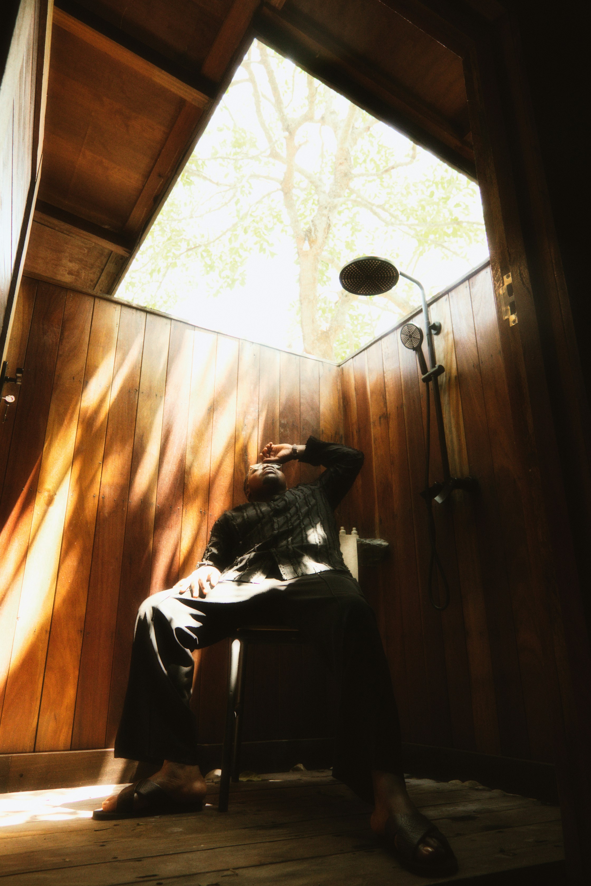 Sunlit Shower: A Quiet Portrait in Warm Wood and Steam