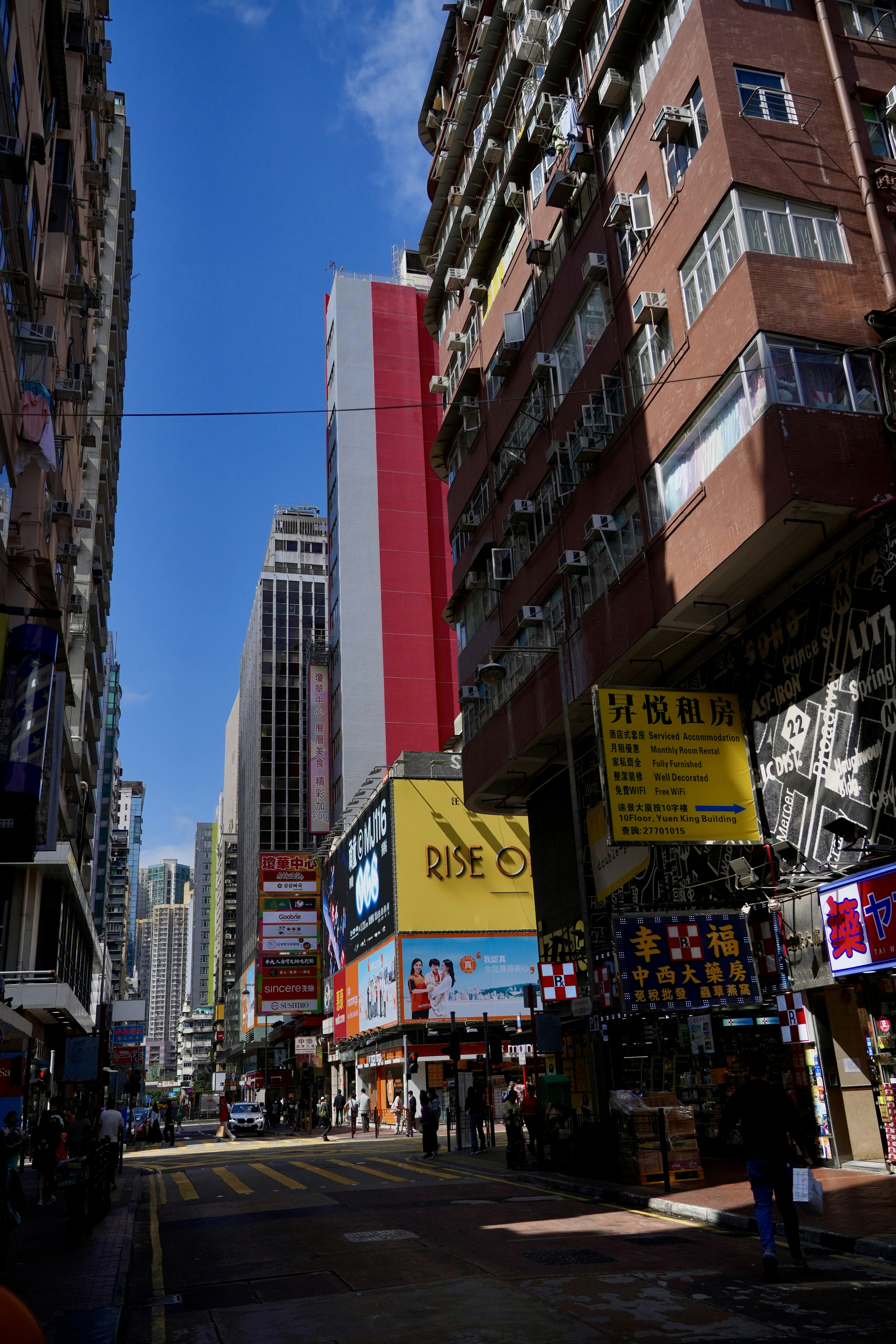 Neon Cast Over a Busy Urban Canyon