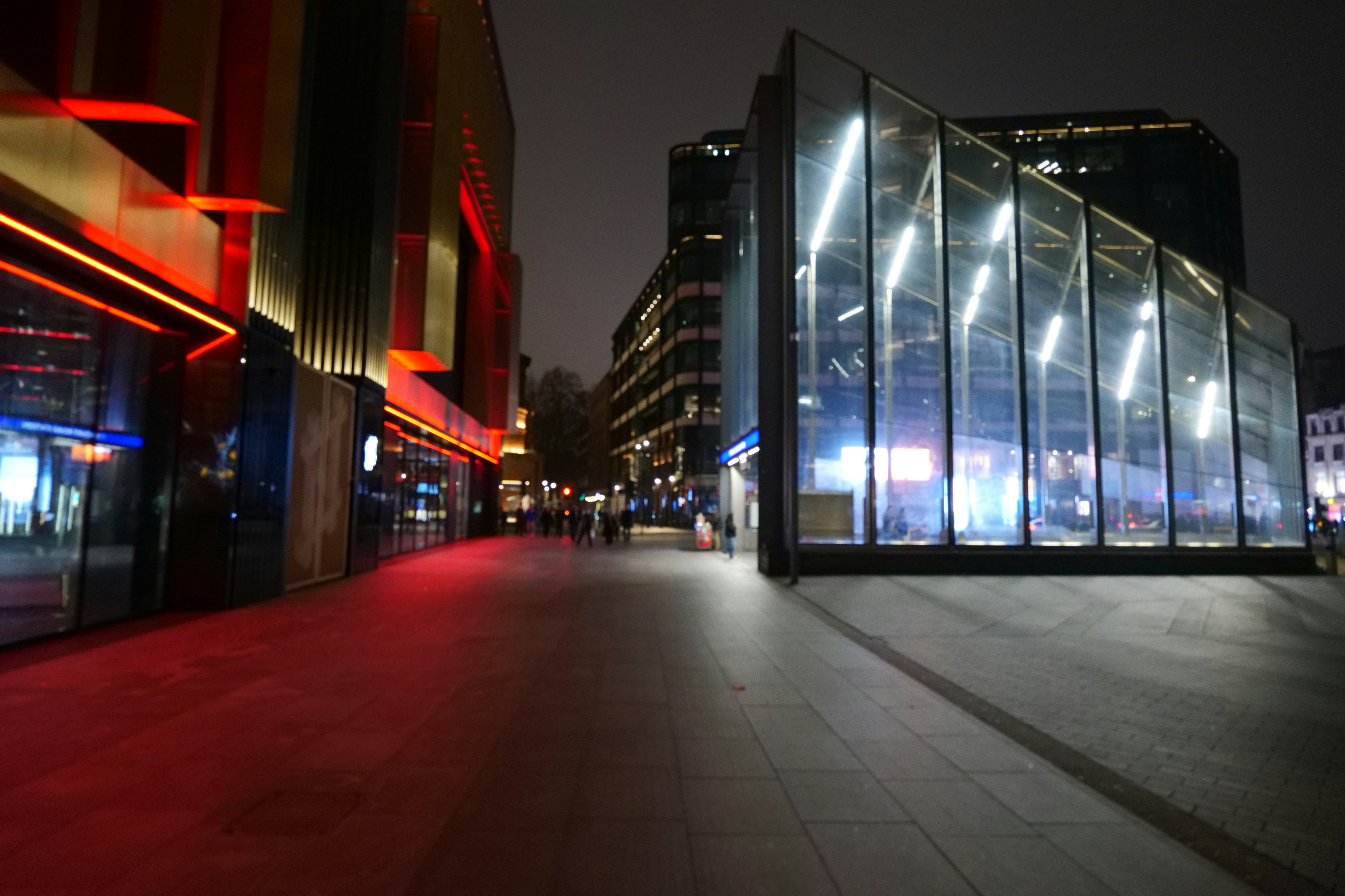 Neon Corridor at Night: A Quiet Walk Between Glass and Concrete