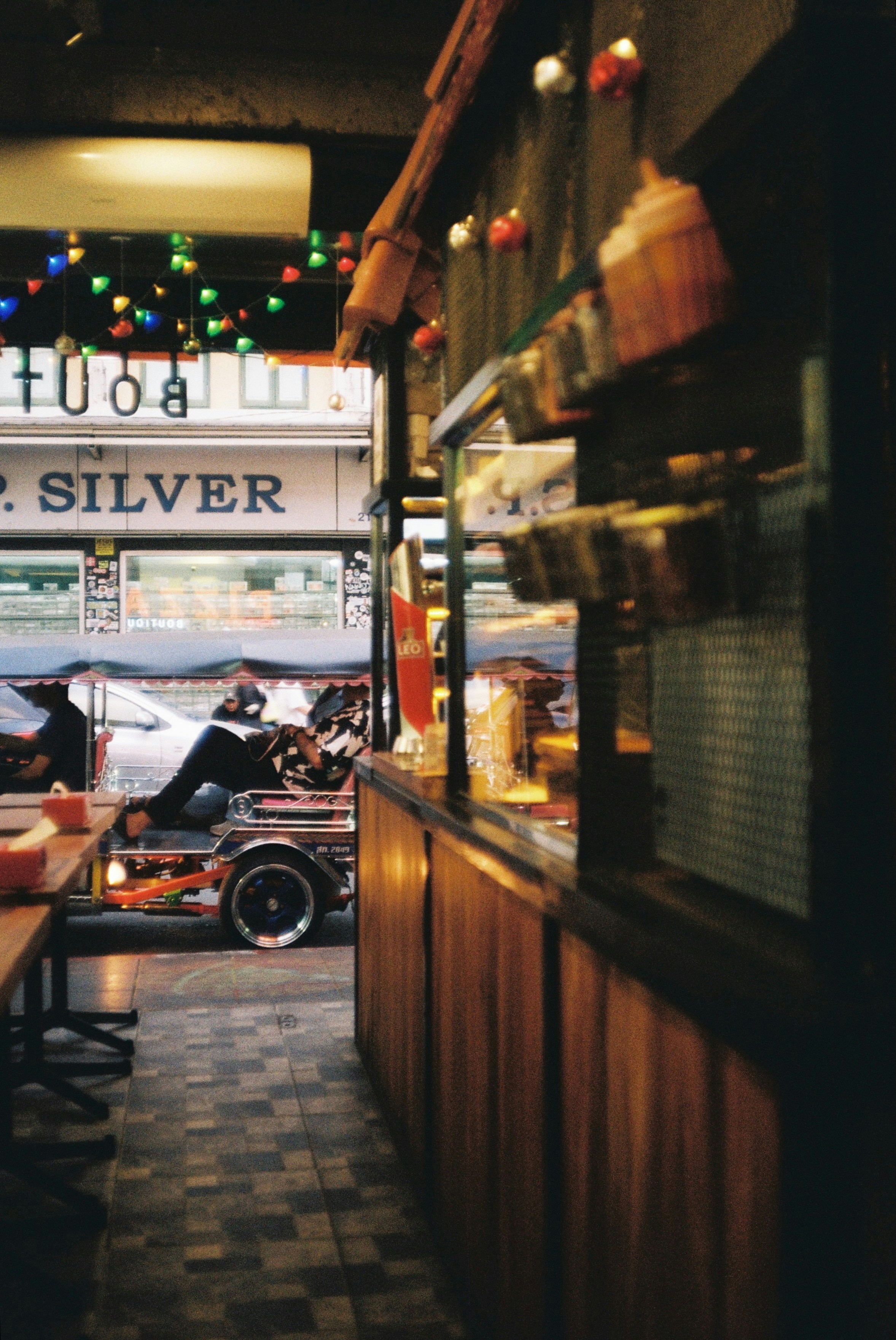 Neon-clad Street Corner Through a Cafe Window