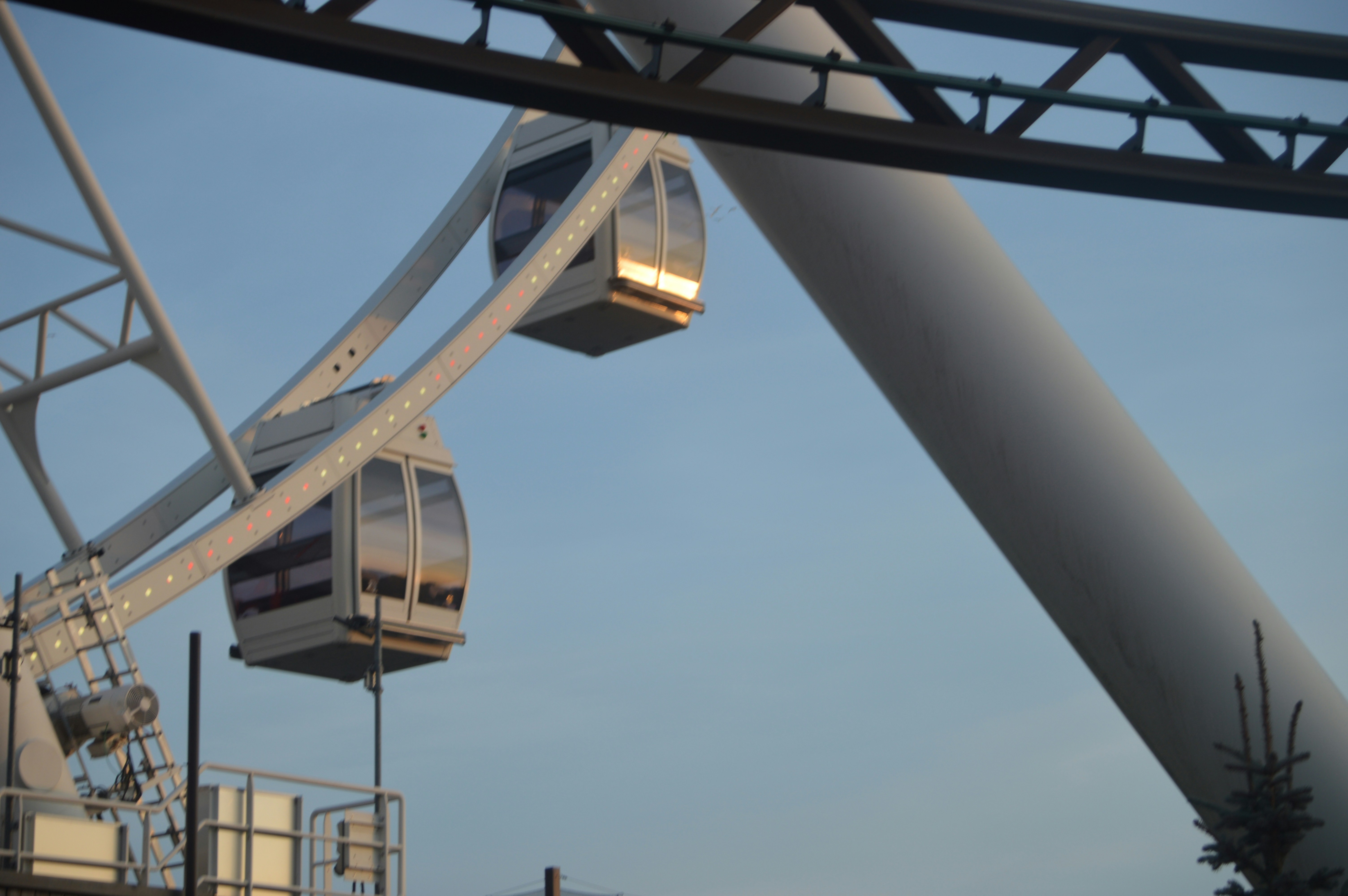 Skyward Wheels: A Ferris Outline Against a Clear Blue