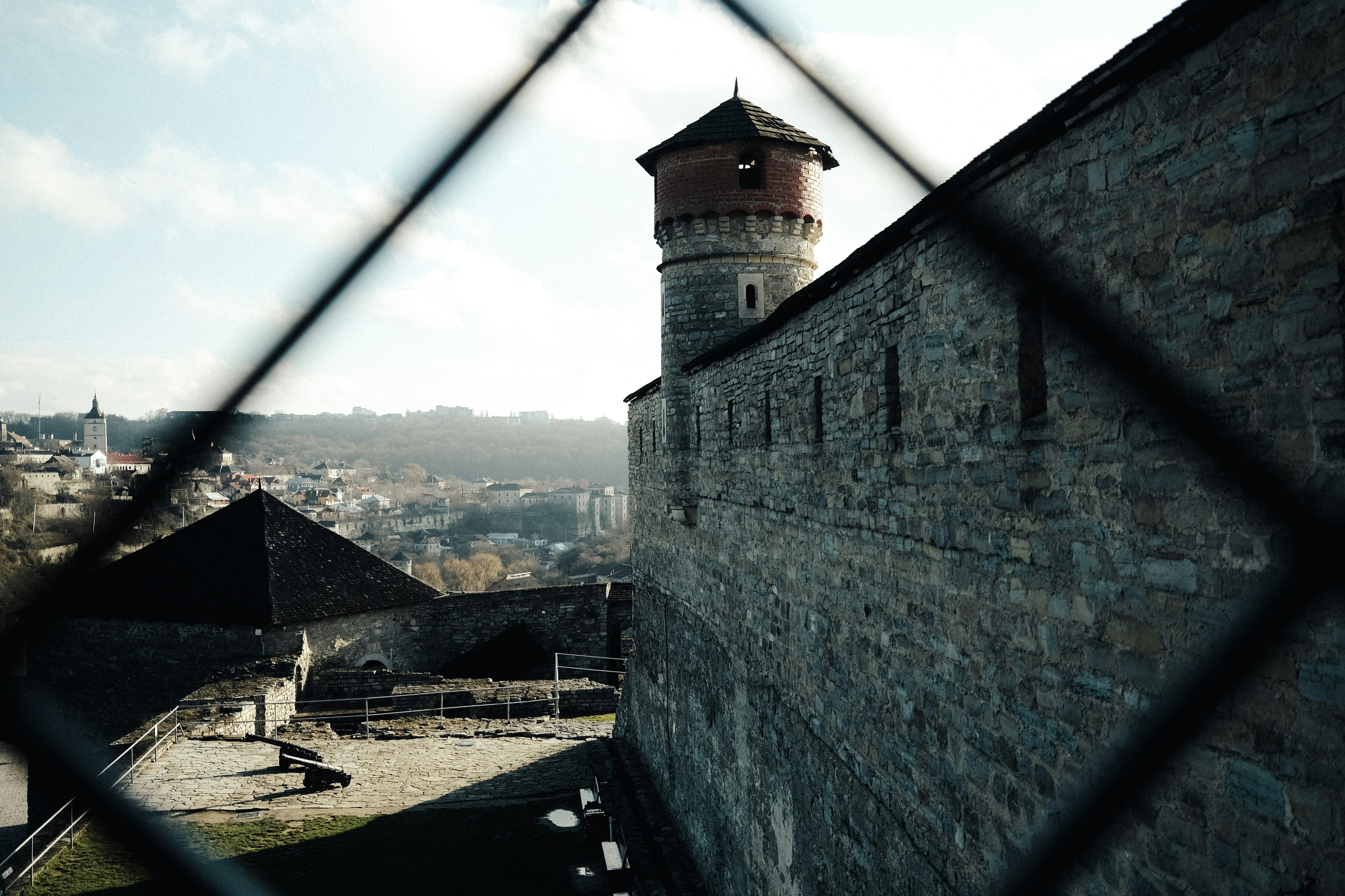 Lines of Time: A Medieval Wall Framed by Modern Grids