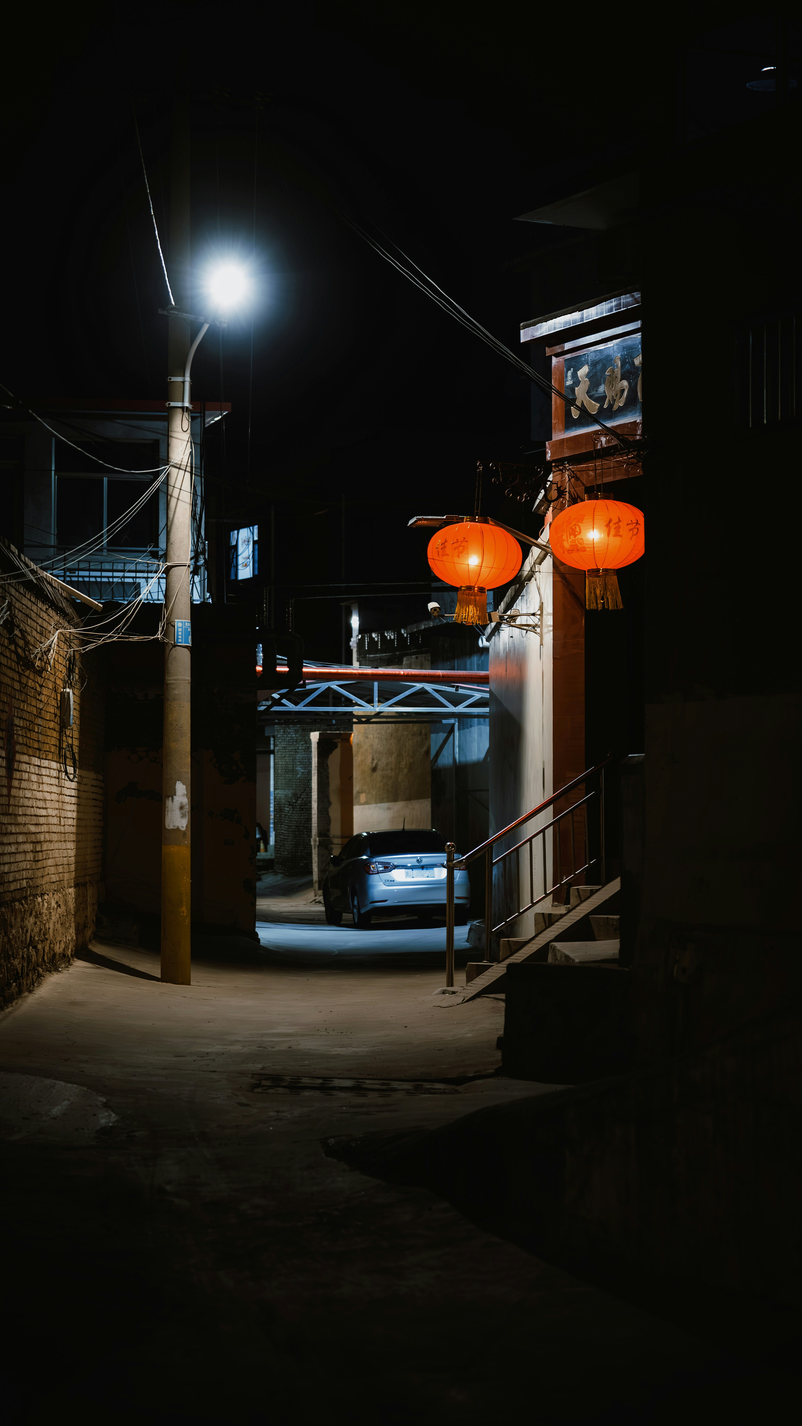 Red Lanterns over a Quiet Alleyway