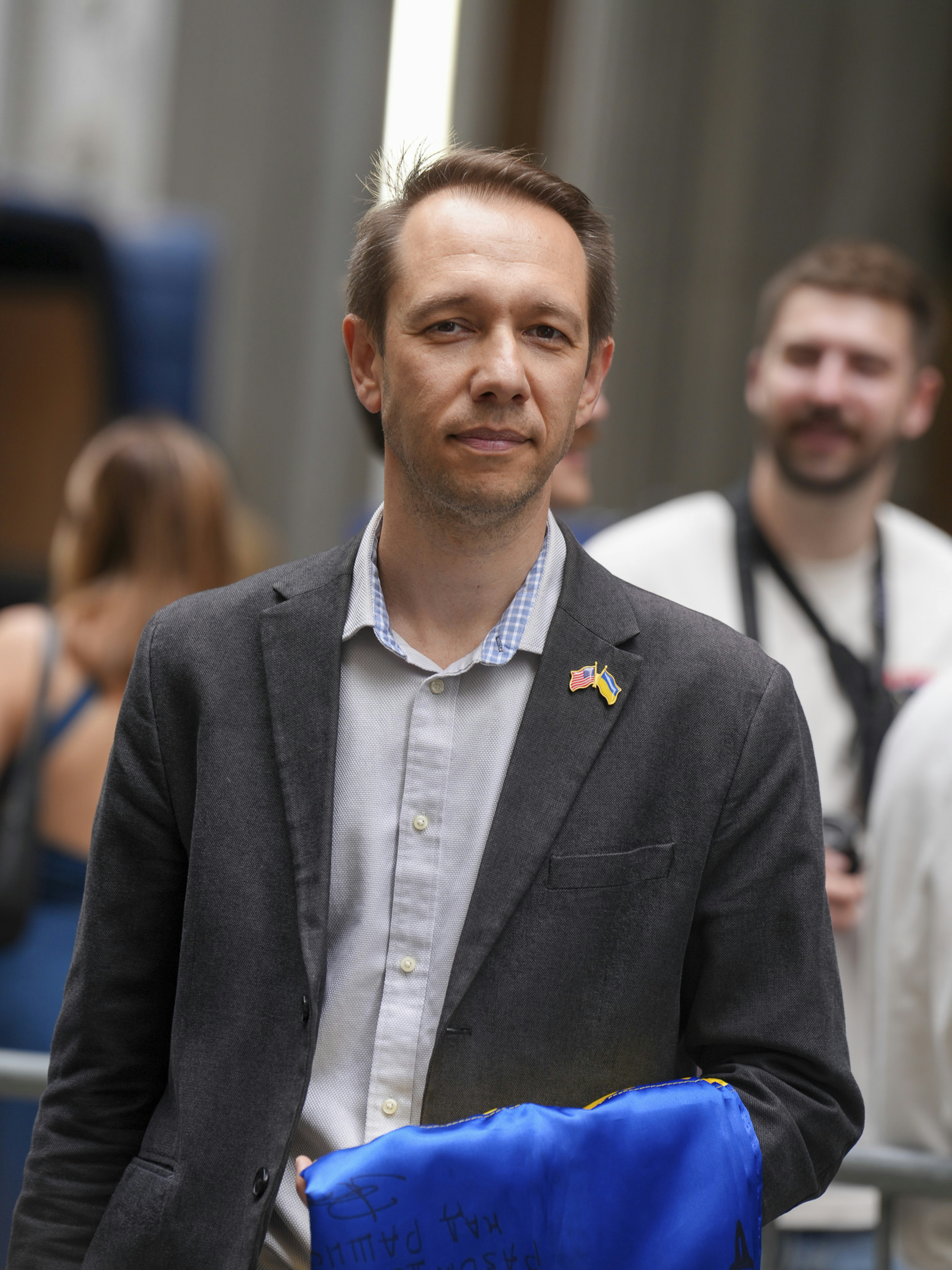 Portrait in a Crowd: Confidence and a Pin on the Lapel