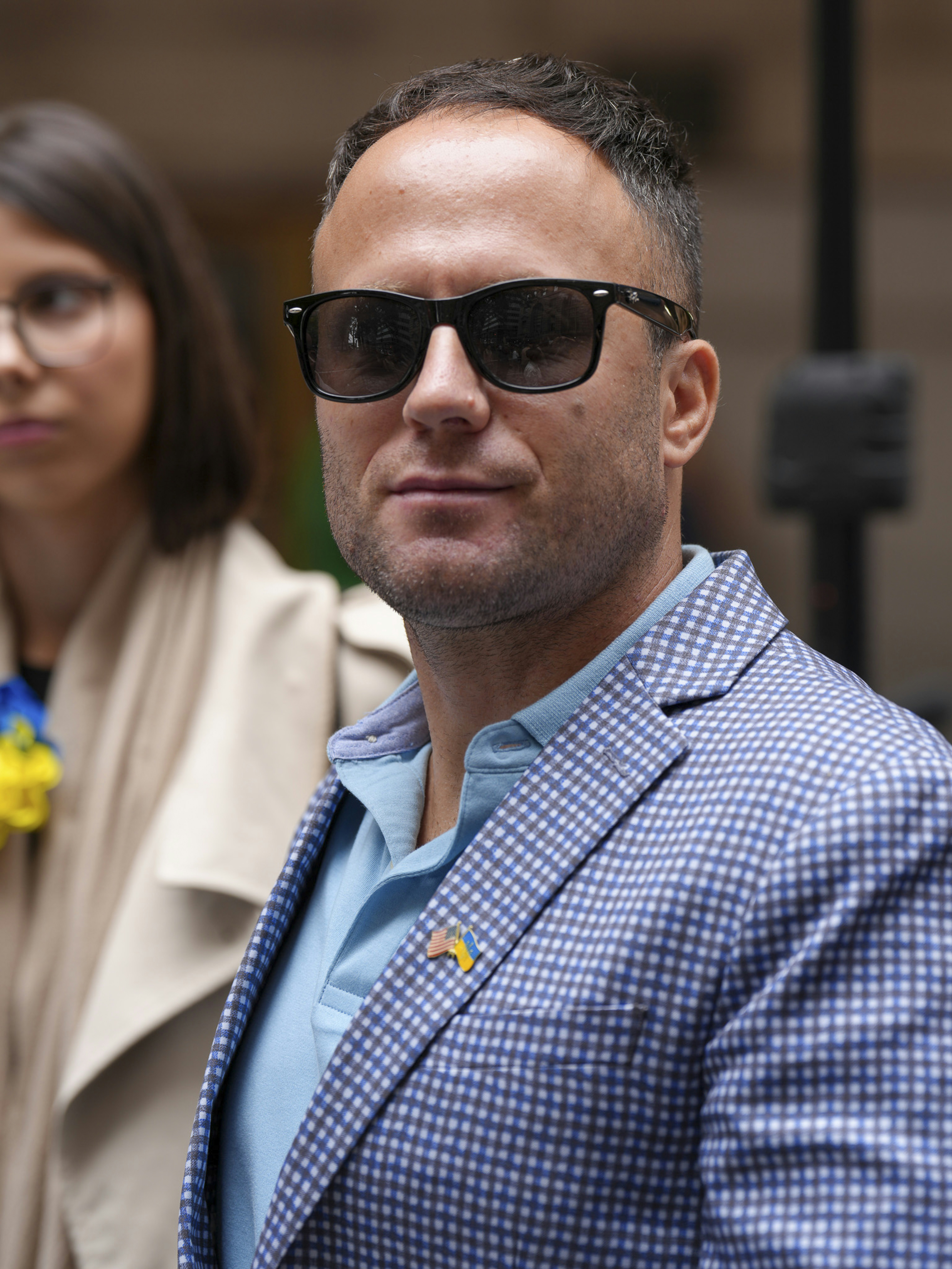 Sunglasses and Suit: A Confident Moment in the City