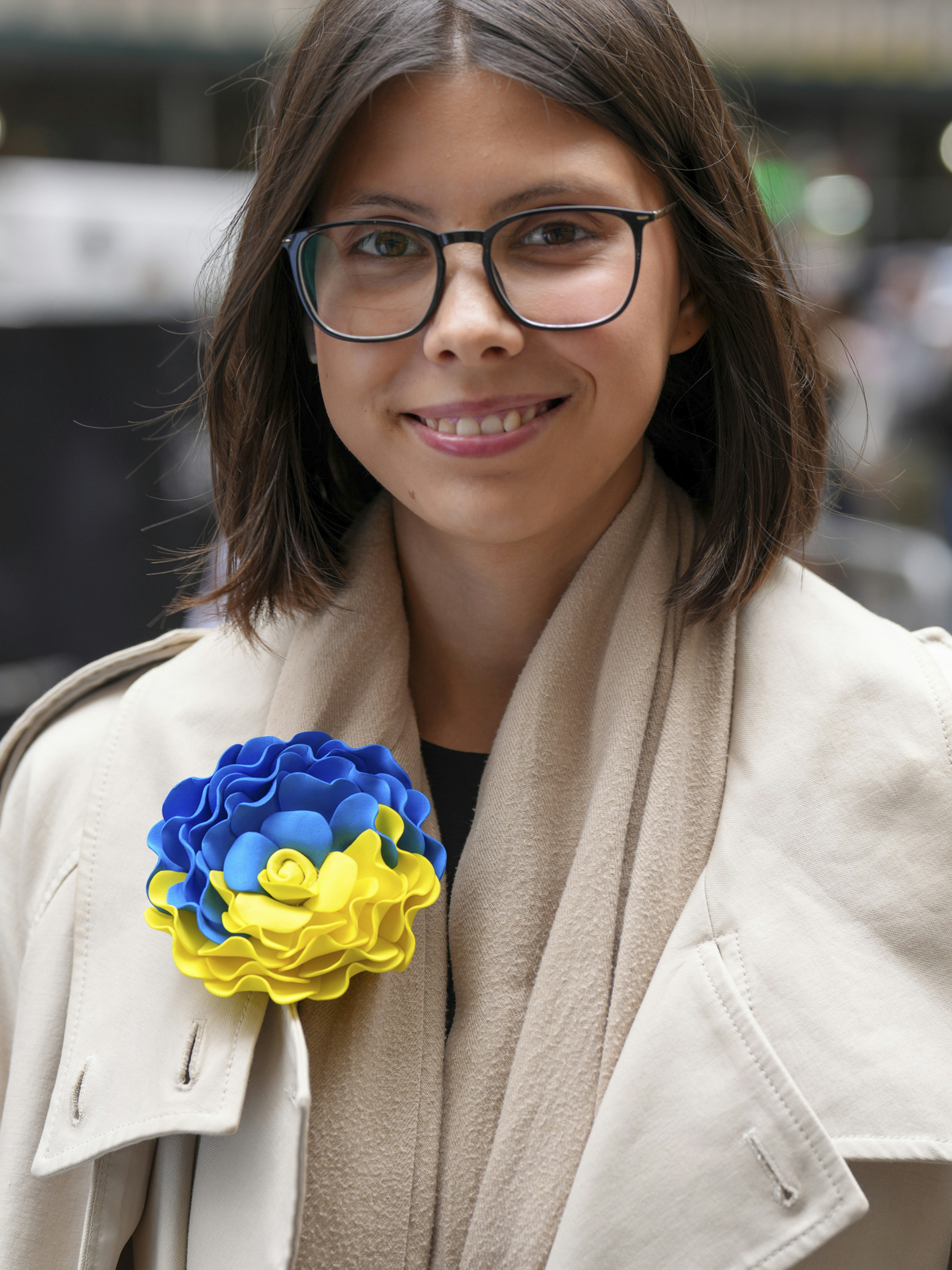 Bright-eyed Portrait with Blue-Yellow Rosette