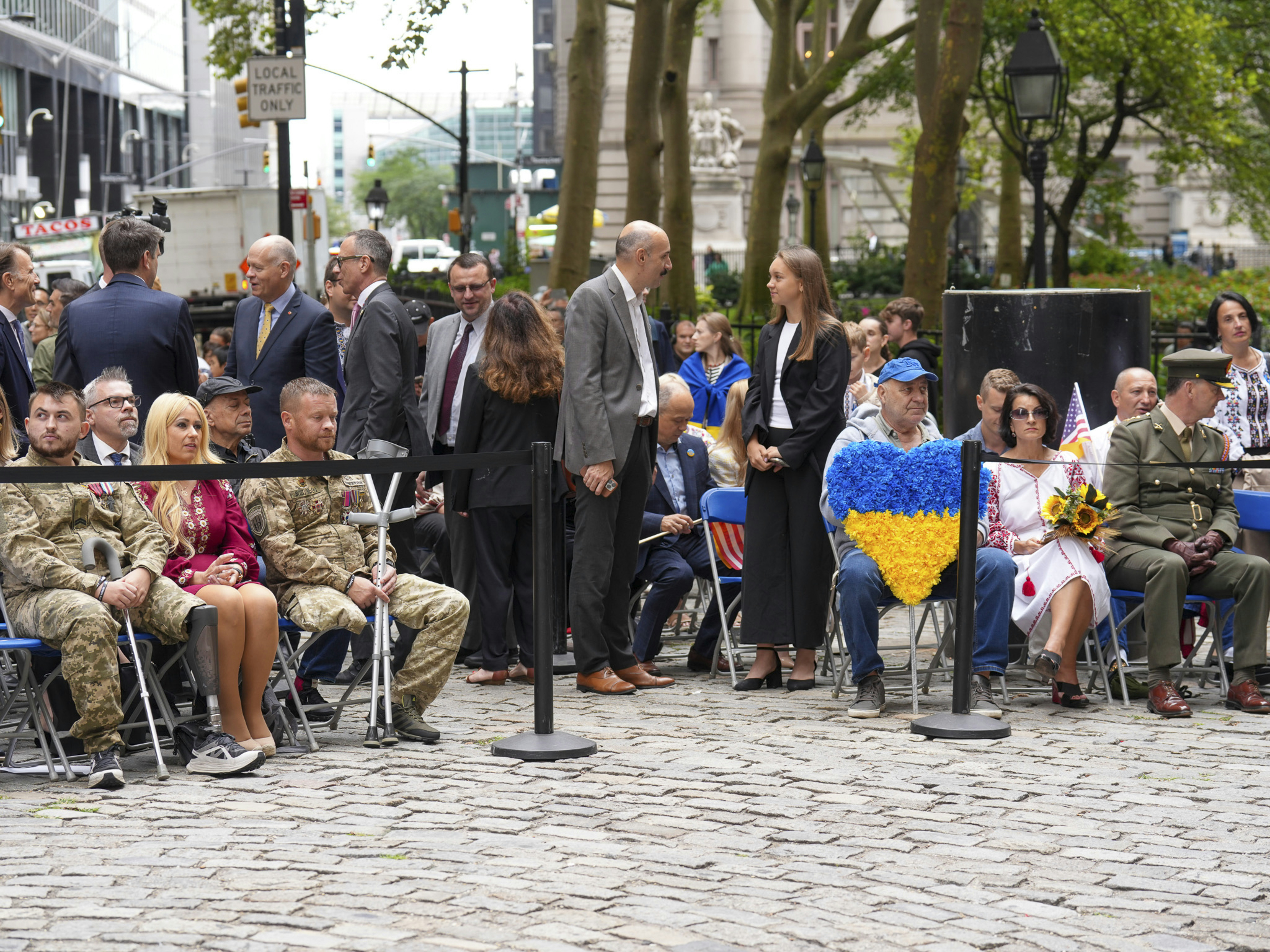 Ceremonial Seating on Cobblestones: A Formal Assembly Unfolds