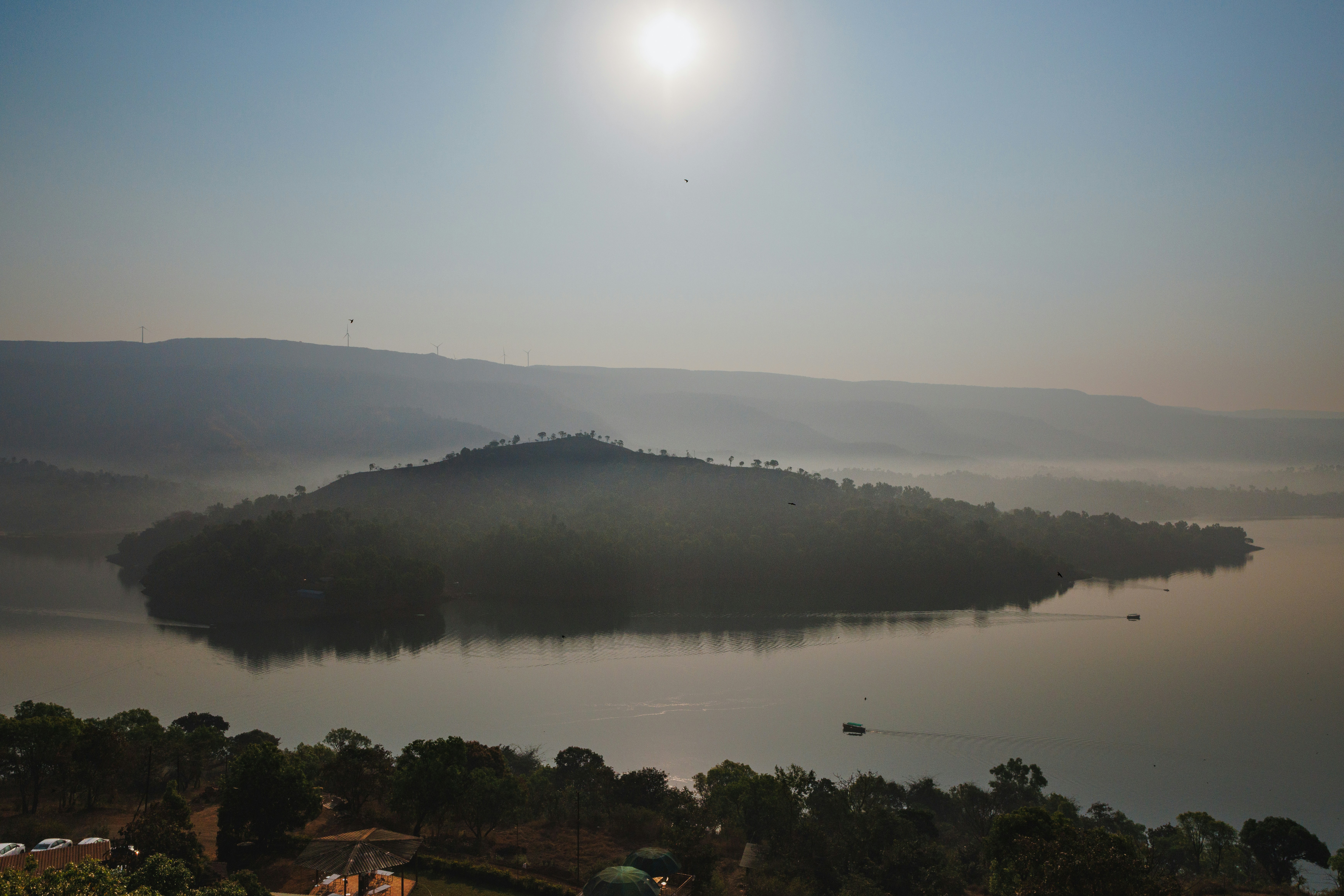 Mist Over the Island: Dawn Silhouette Above a Tranquil Lake