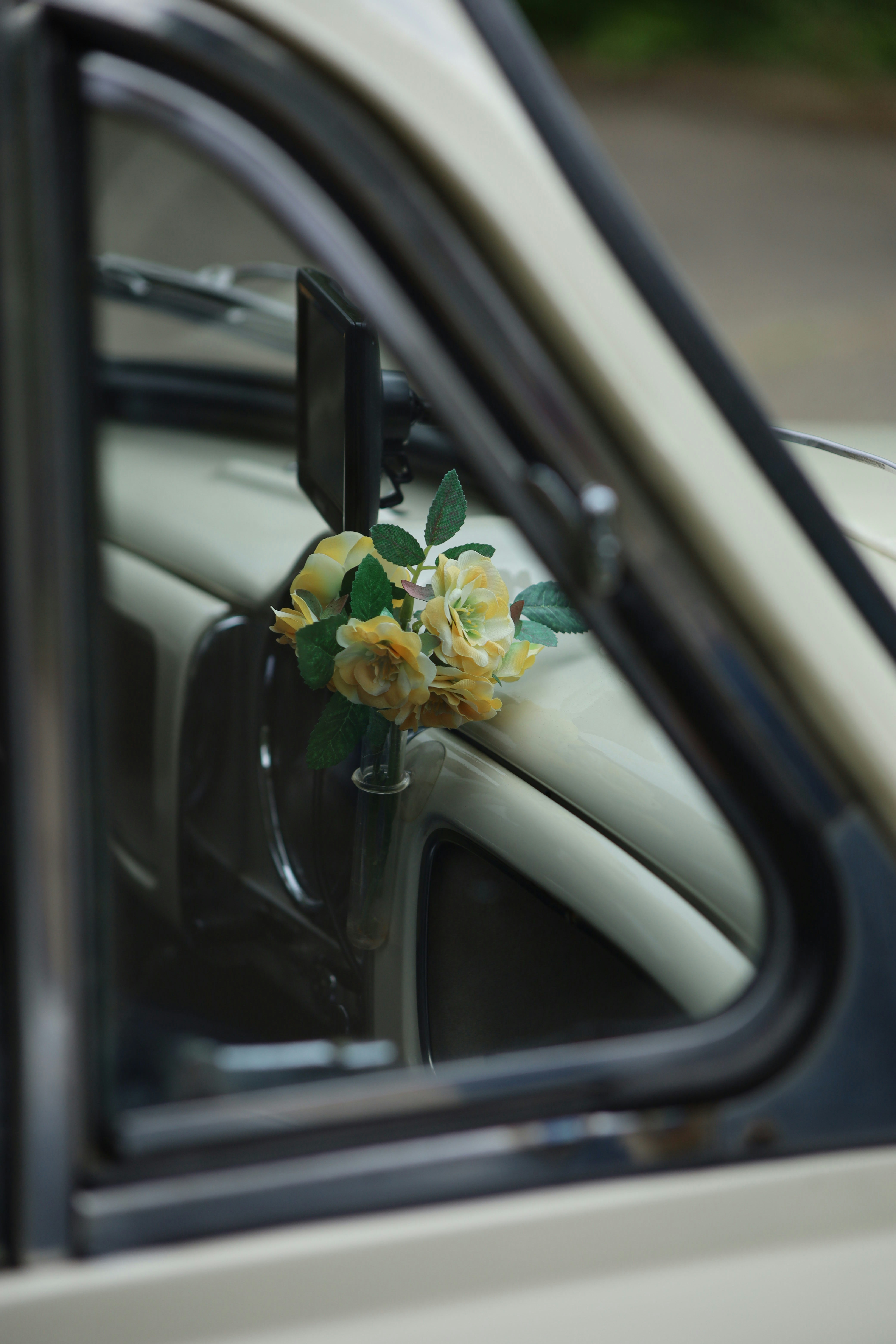 Floral Accent in the Rearview: A Vintage Car’s Quiet Detail