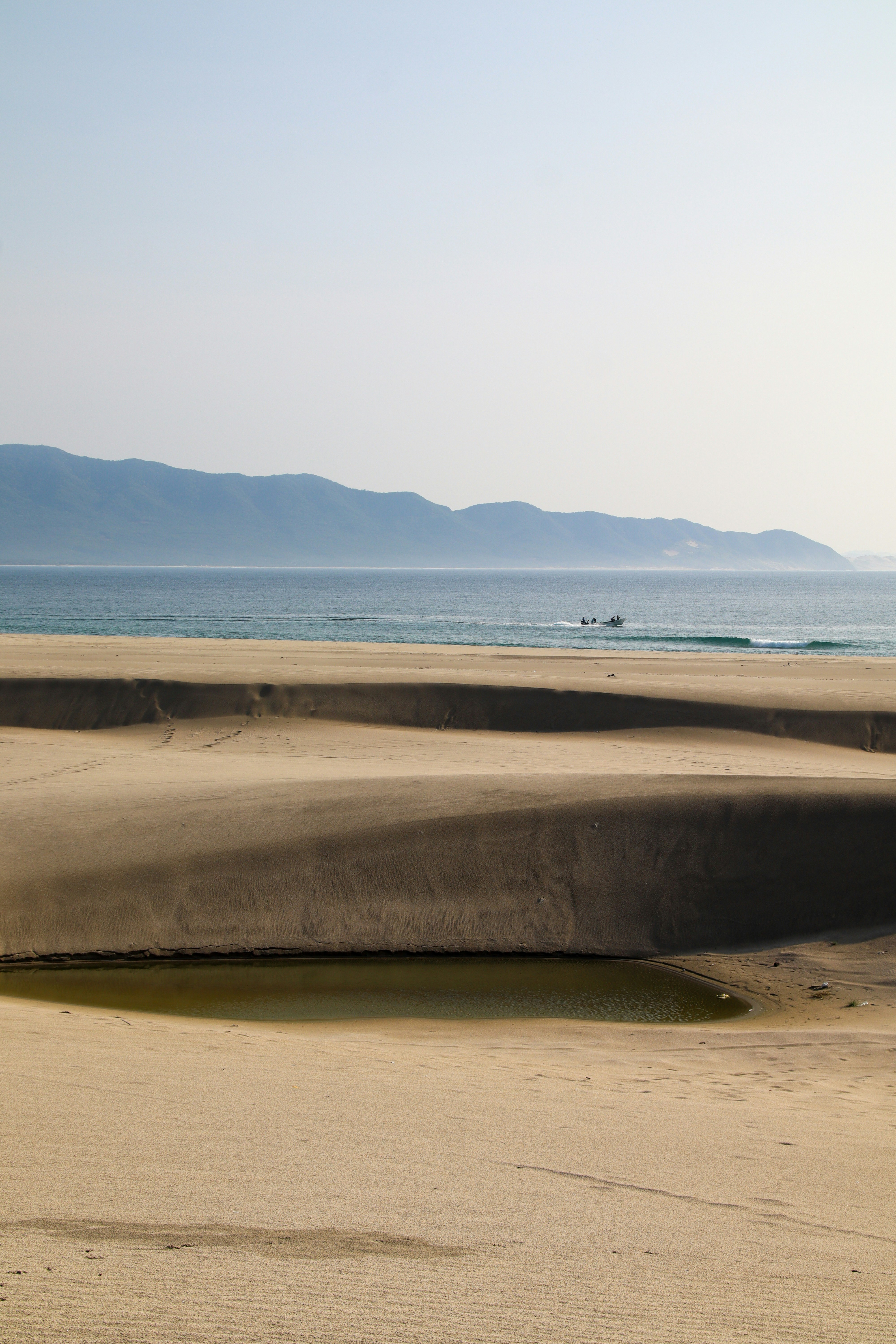 Sculpted Sand Rifts Meeting the Quiet Sea