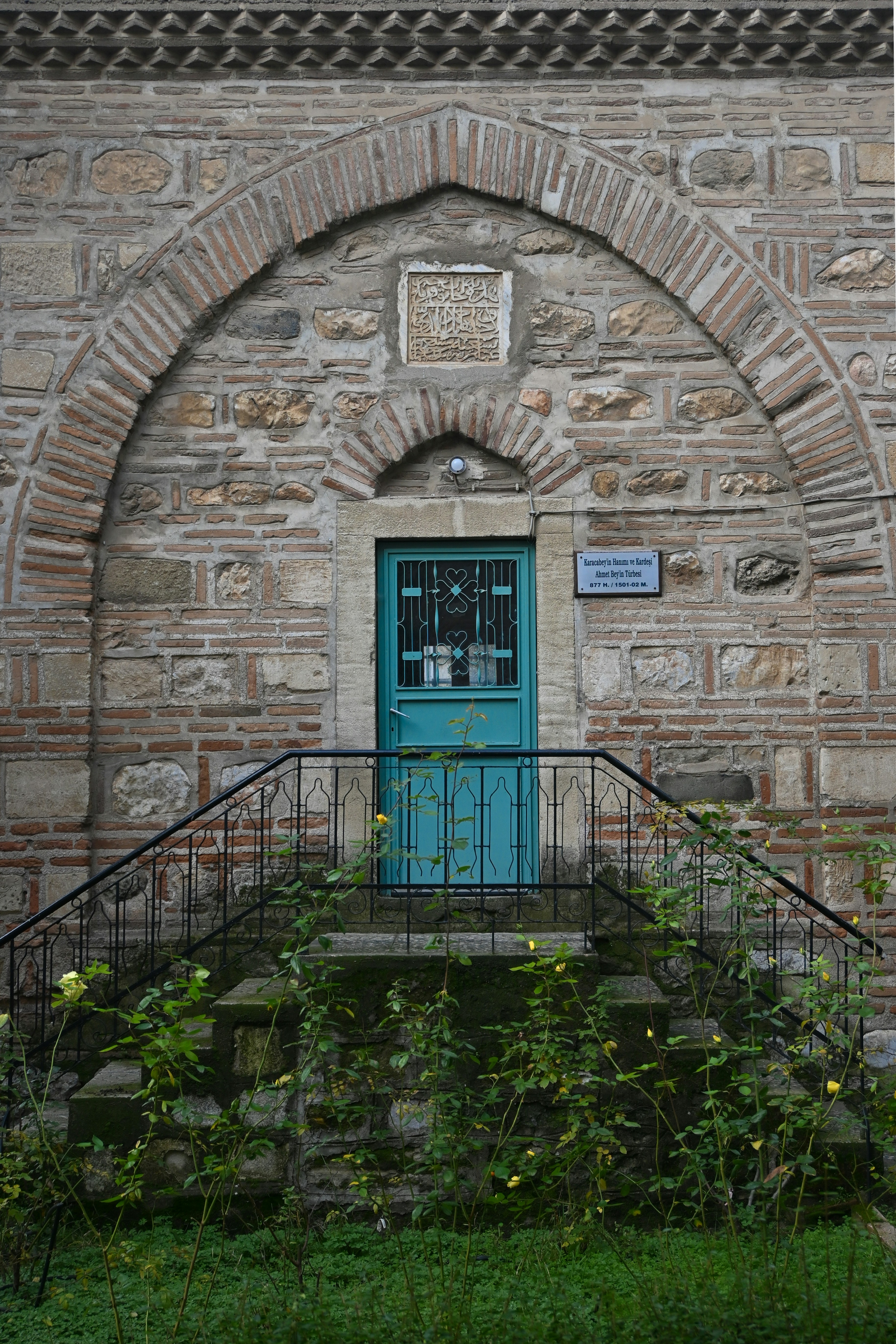 Turquoise Door in an Ancient Stone Archway