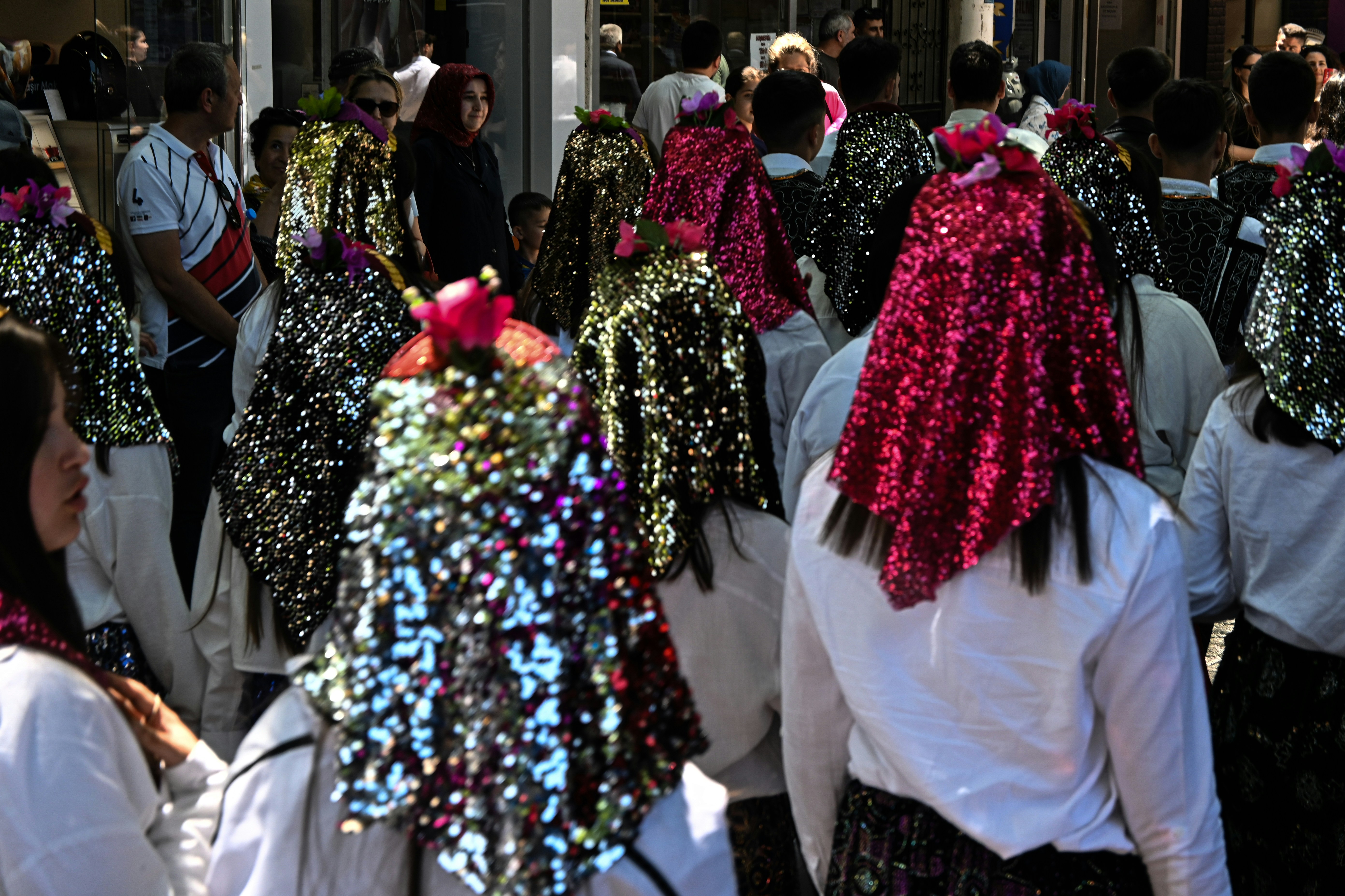 Shimmering Veils in a Sea of White Shirts