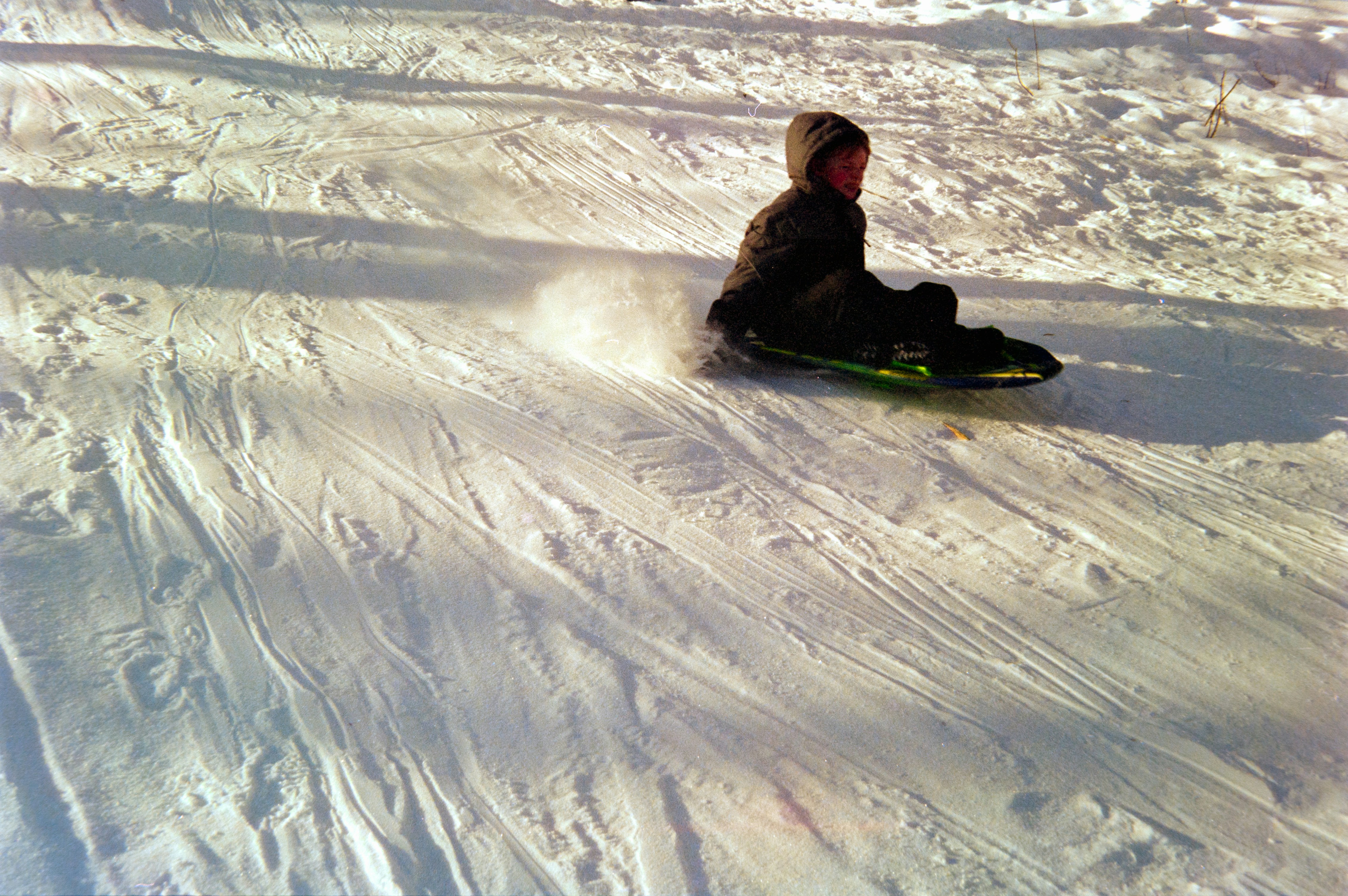 Snowbound Sprint: A lone rider carves through a sunlit slope