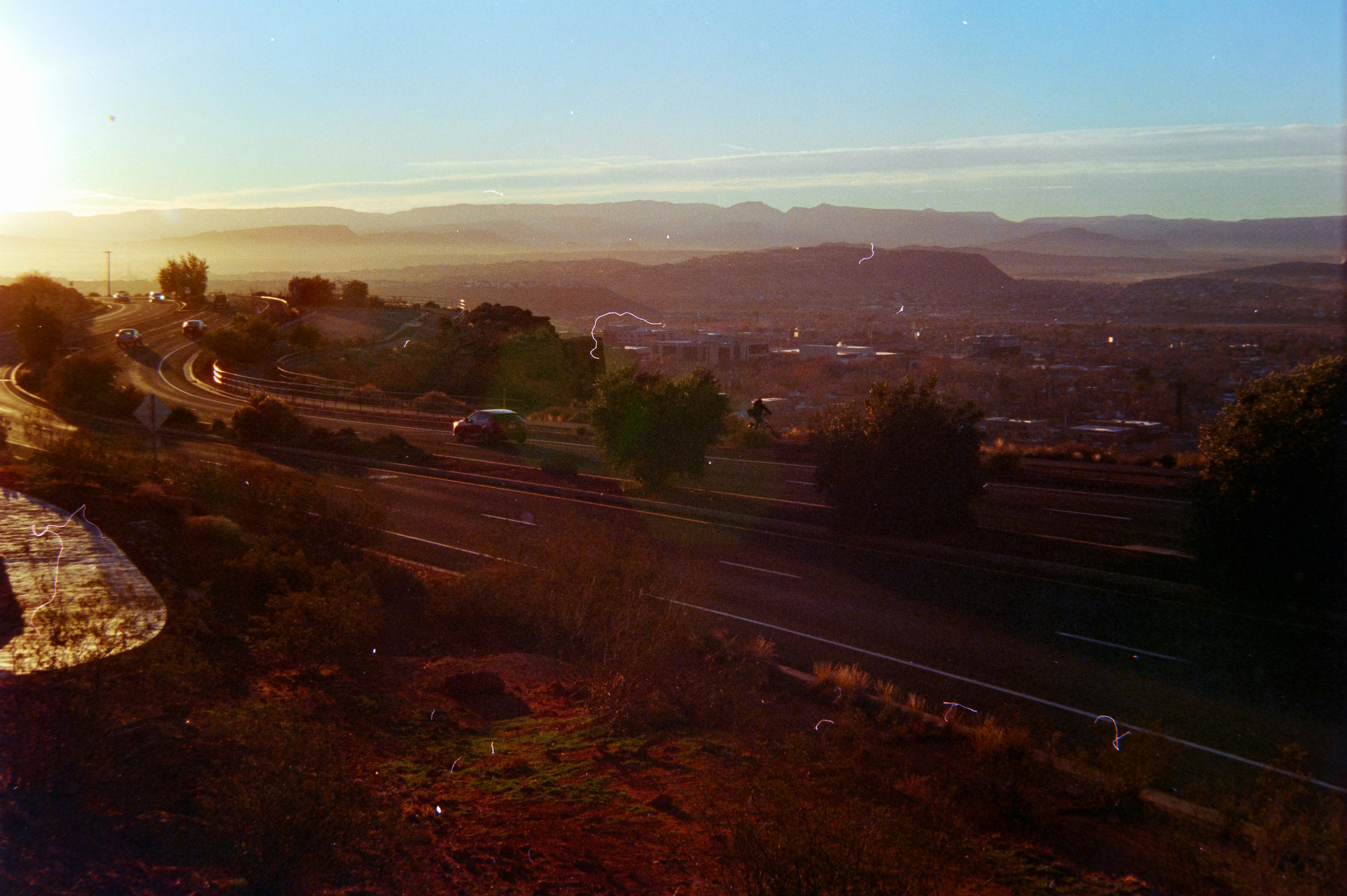Sunlit Valley Over Hwy: A Quiet Evening Panorama